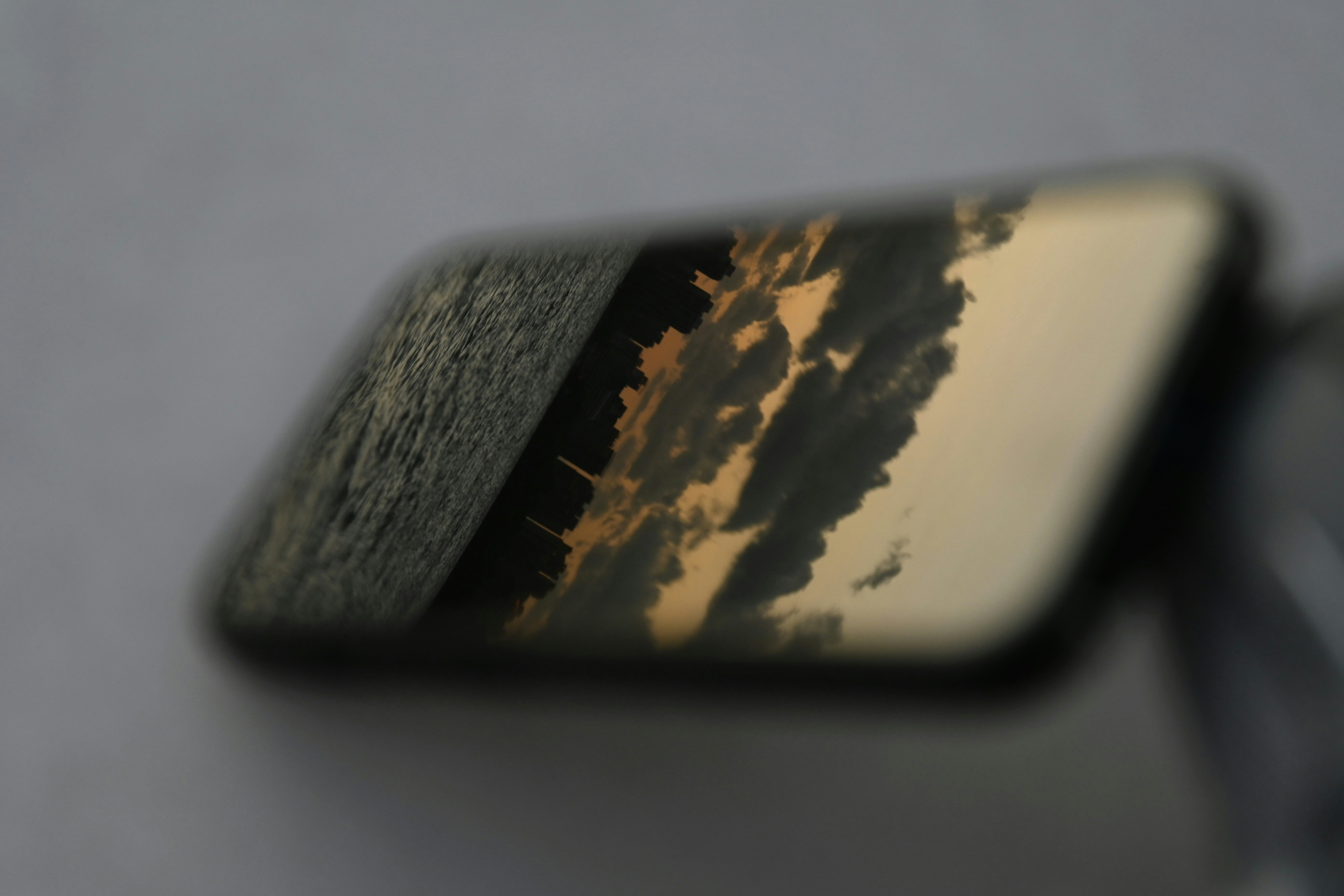 the world in the screen | A reflection of sky and water.