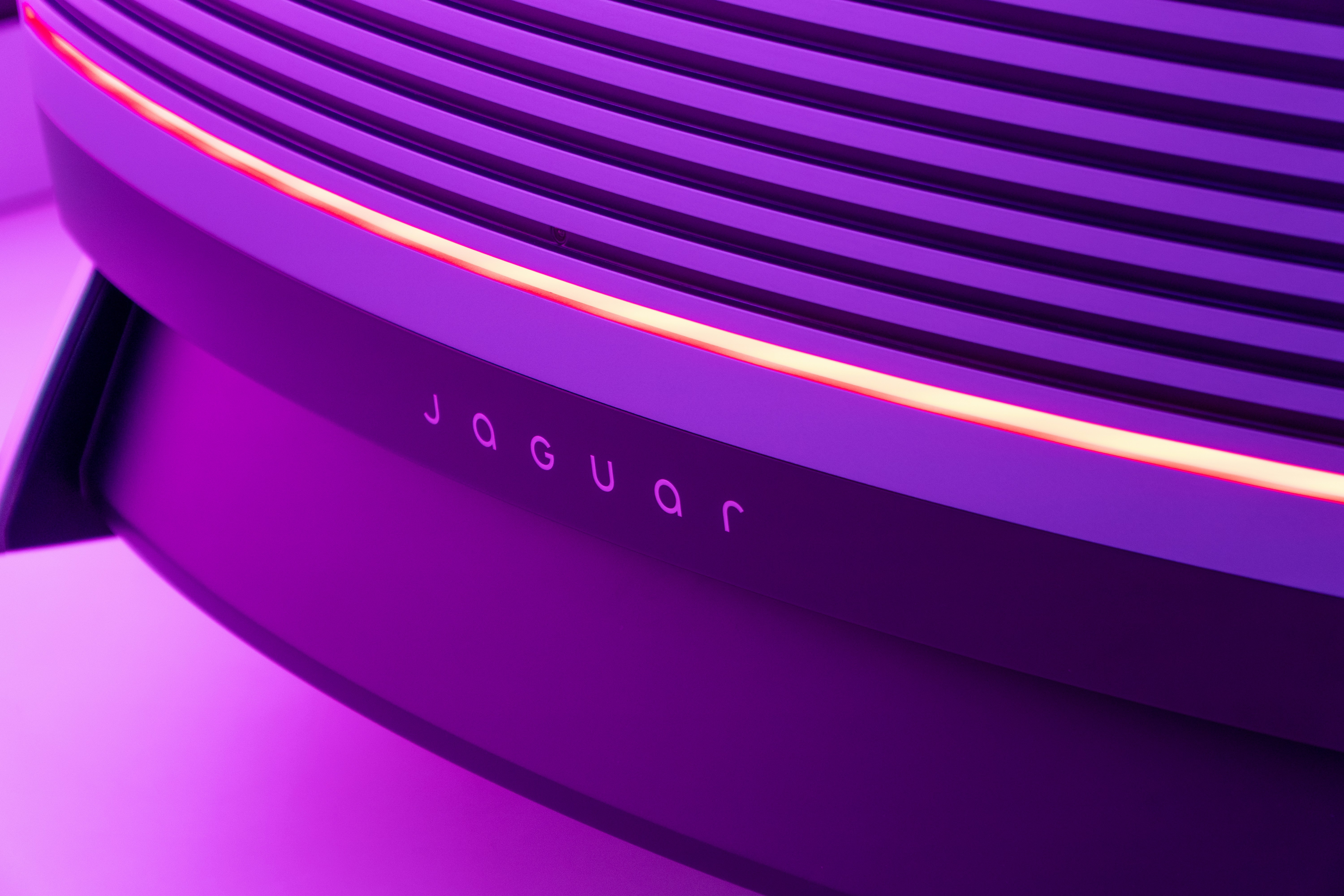 A jaguar vehicle's illuminated, angled design.