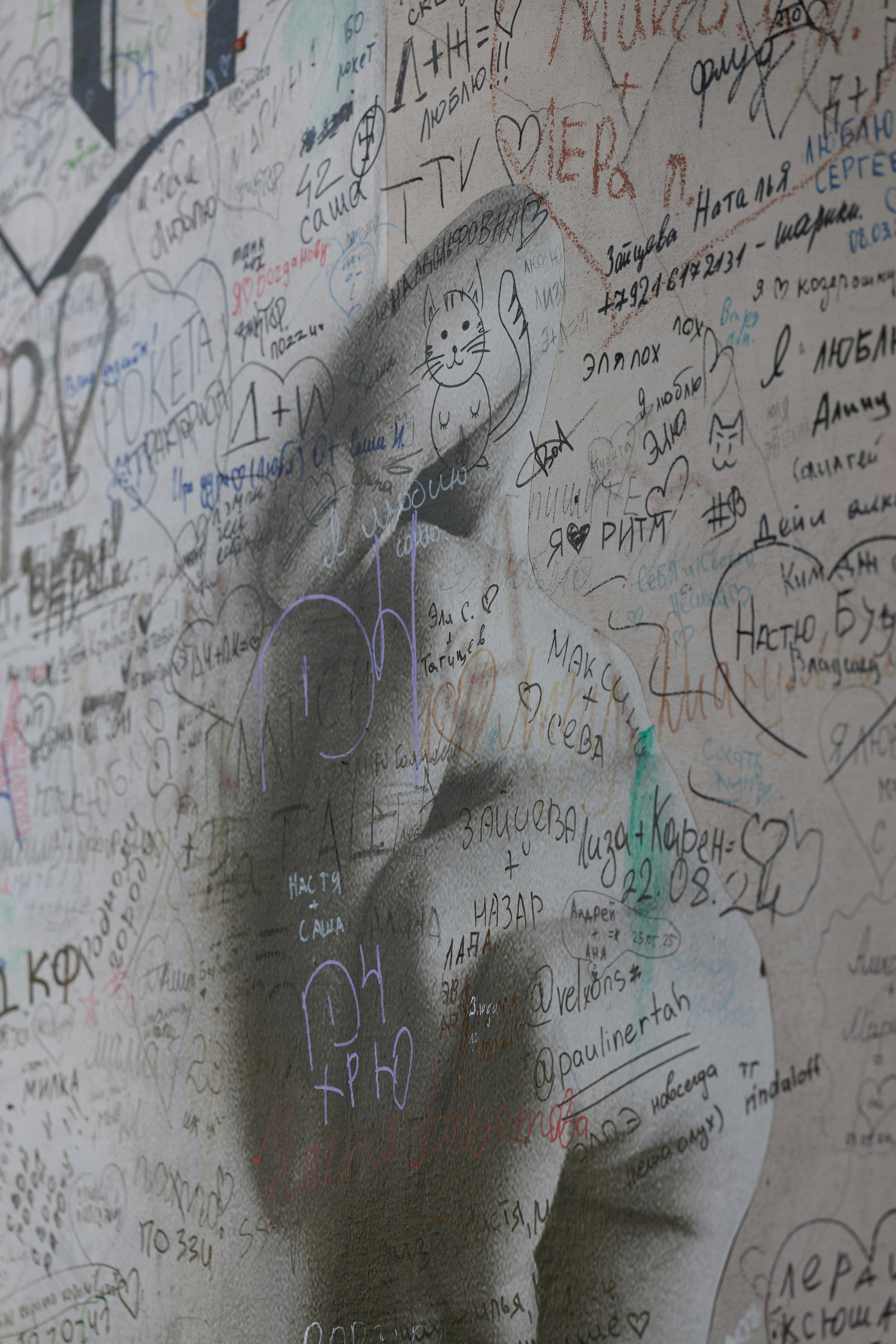 A woman's form superimposed over graffiti-covered wall. photo – Free ...