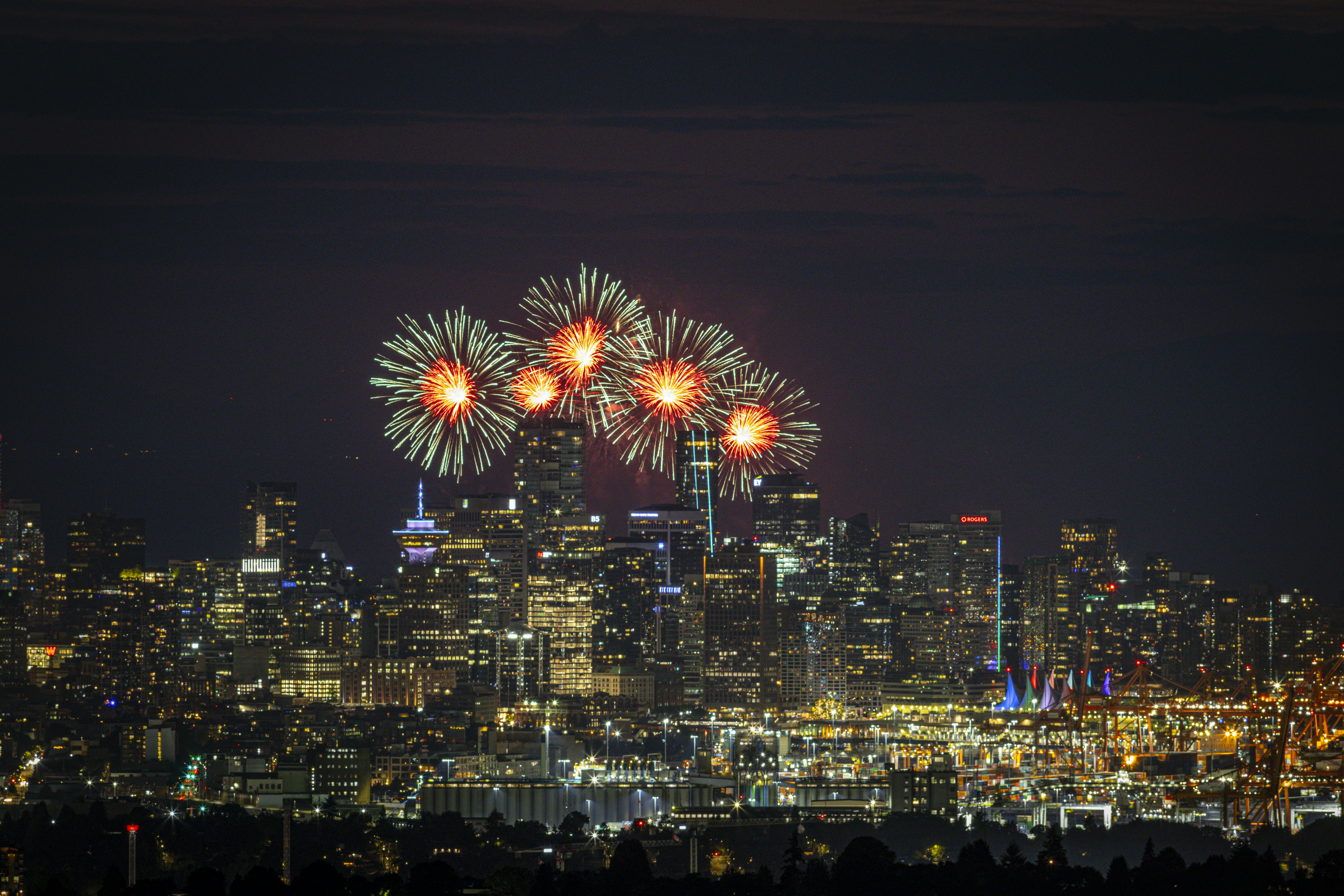 Illuminated Celebrations Above the Urban Canvas