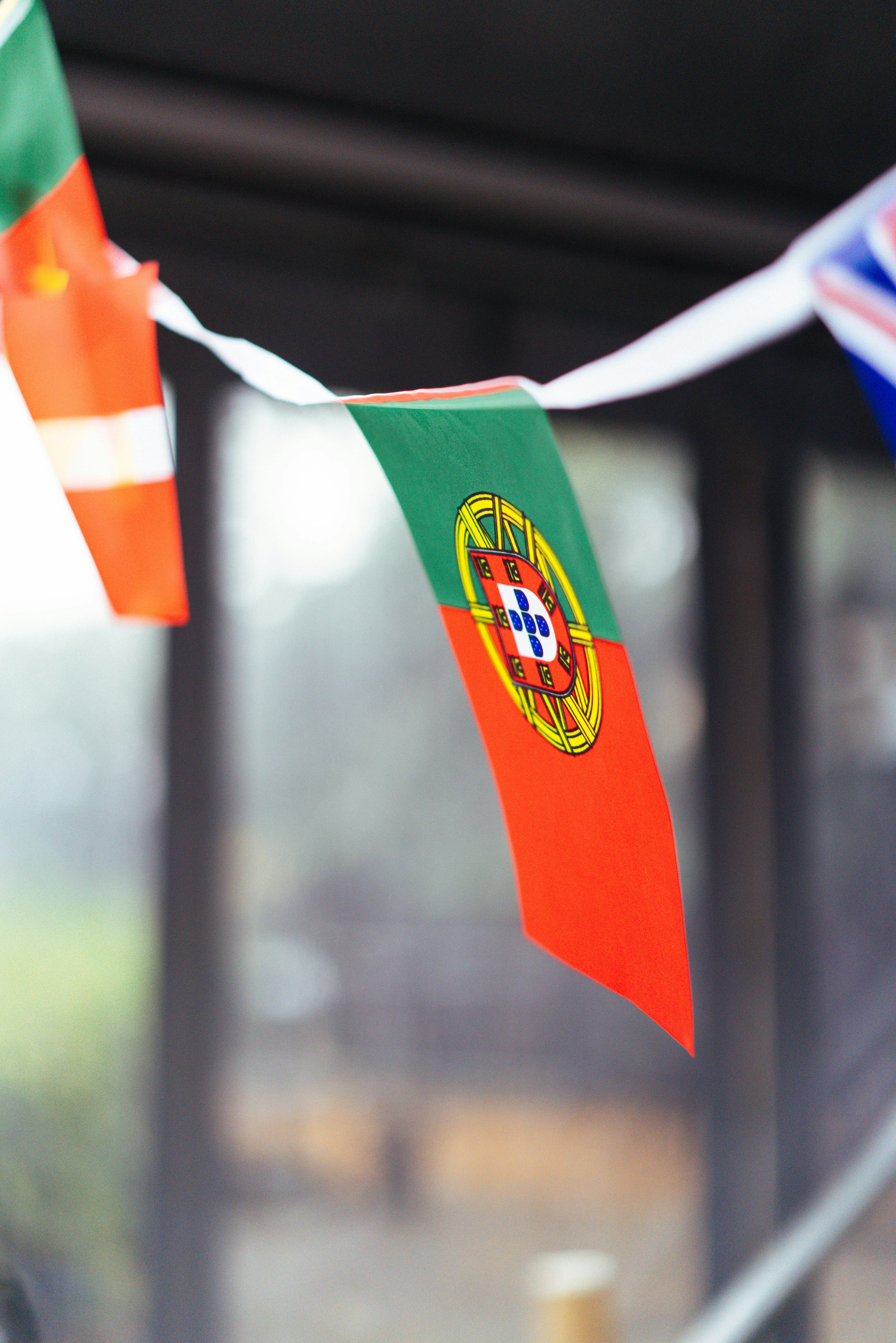 Flags of different countries are displayed on a banner.