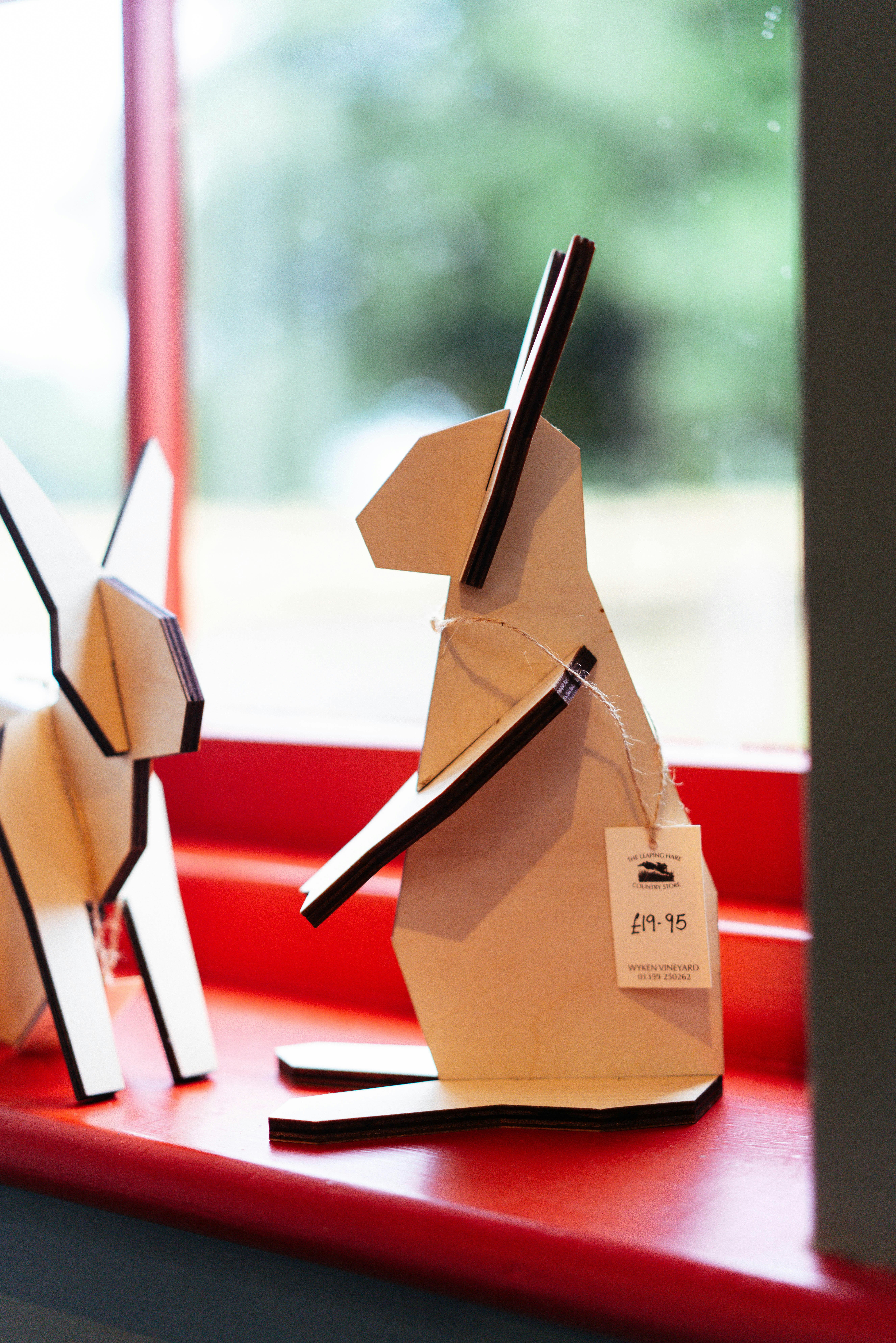 Facet Figures on a Crimson Windowsill