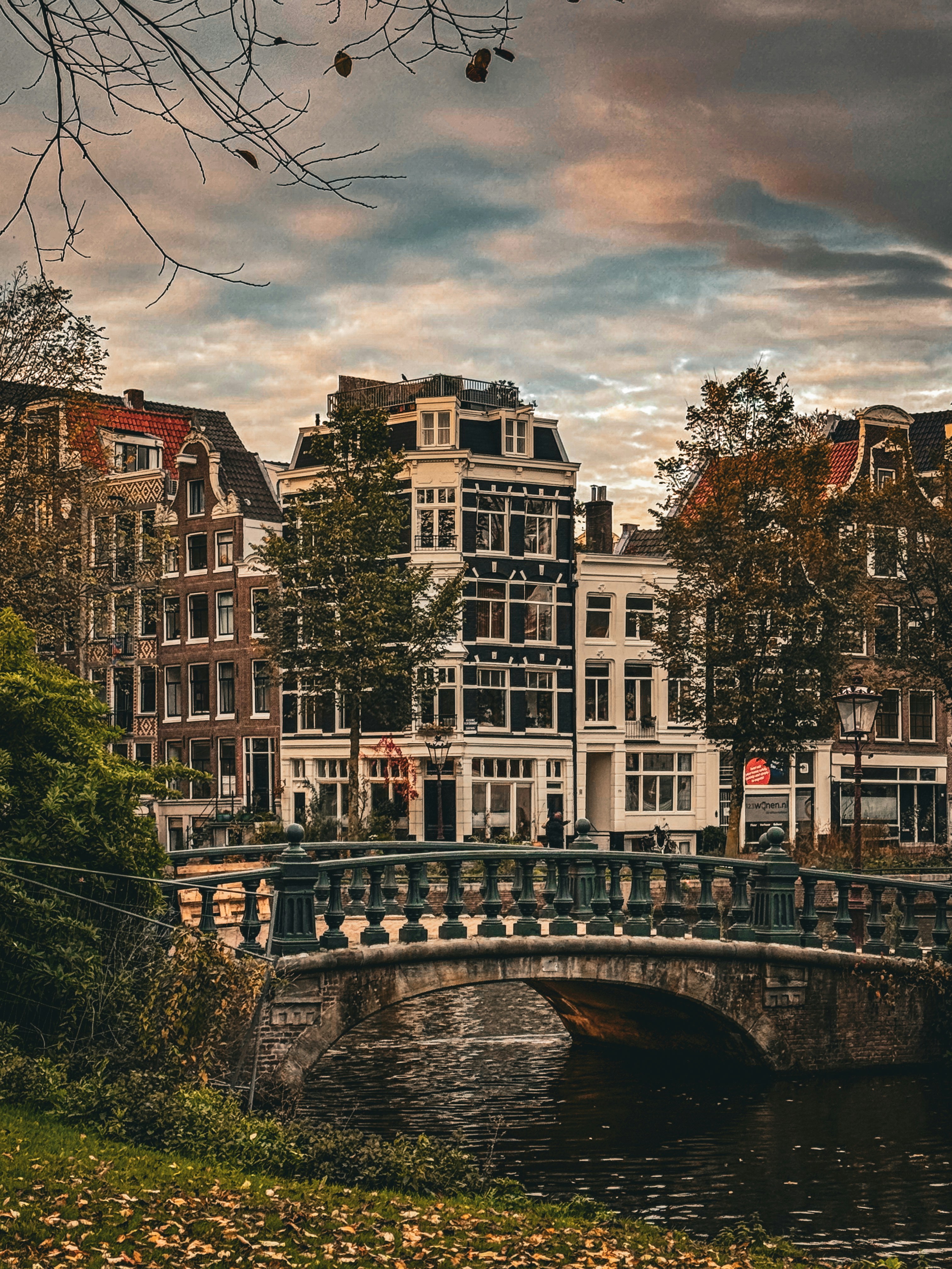 Canal houses in amsterdam with a bridge. photo – Free Building Image on ...