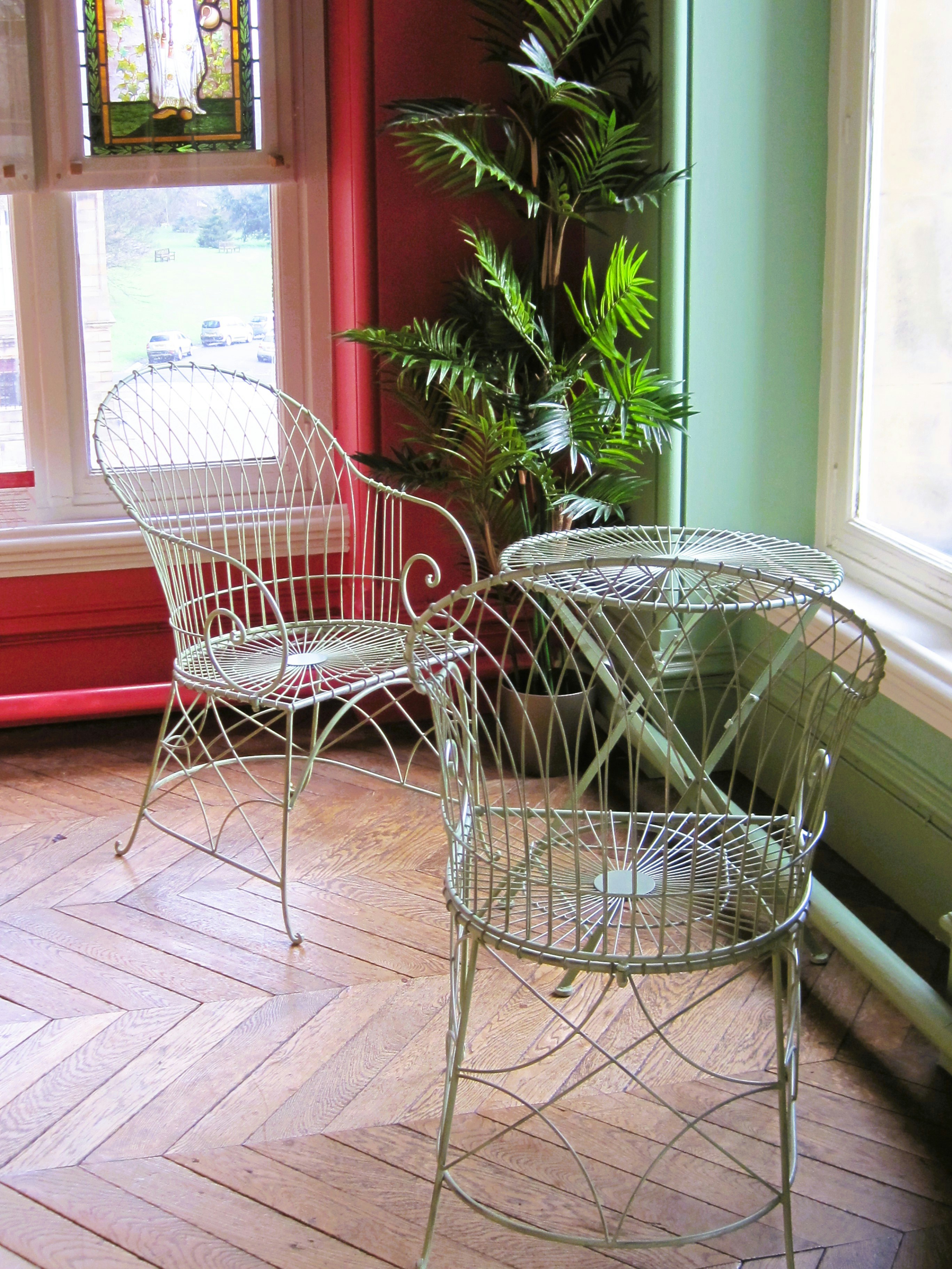 taken march 12th 2020 | Wicker chairs sit in a charming, colorful room.