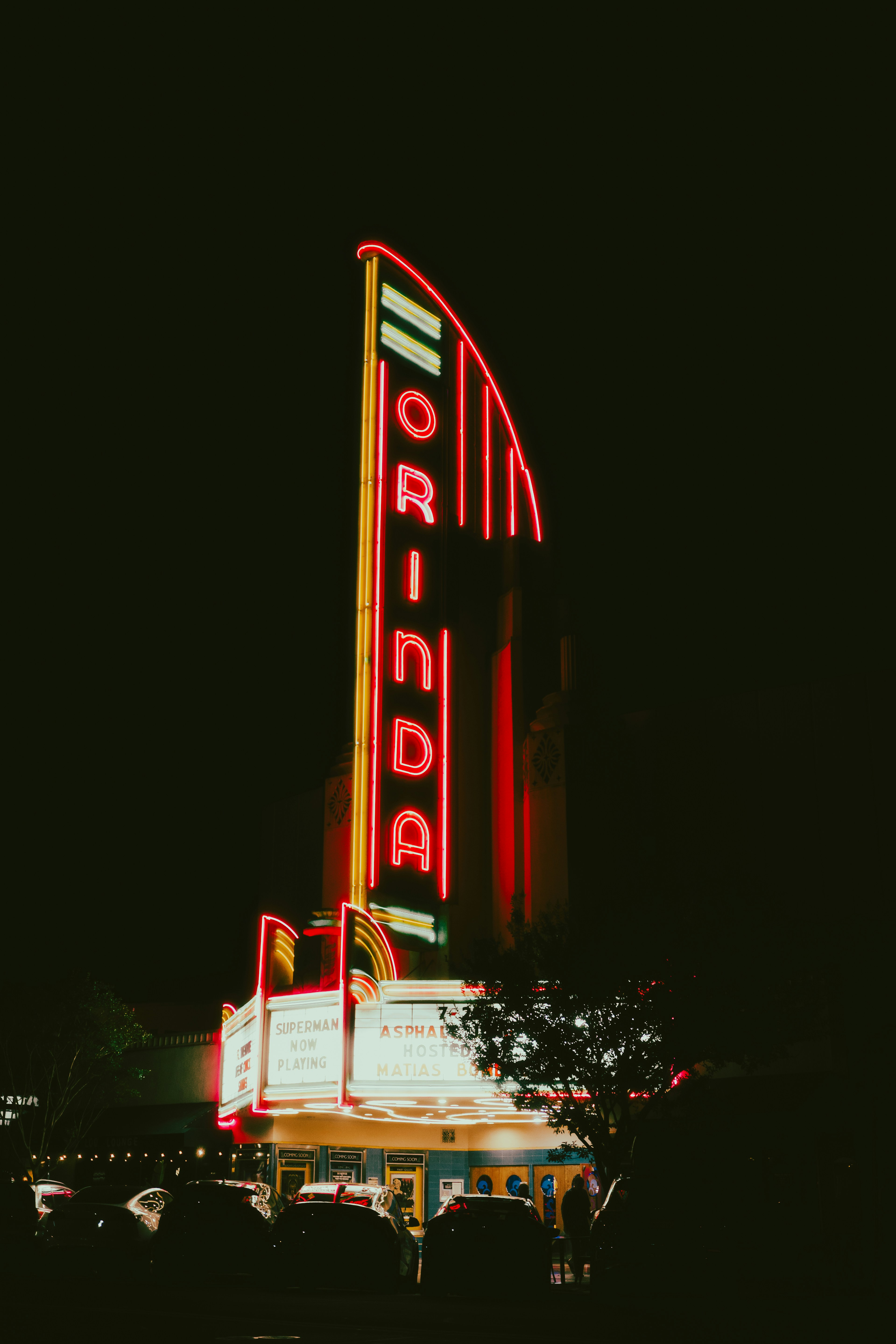 The orinda theatre illuminated at night.