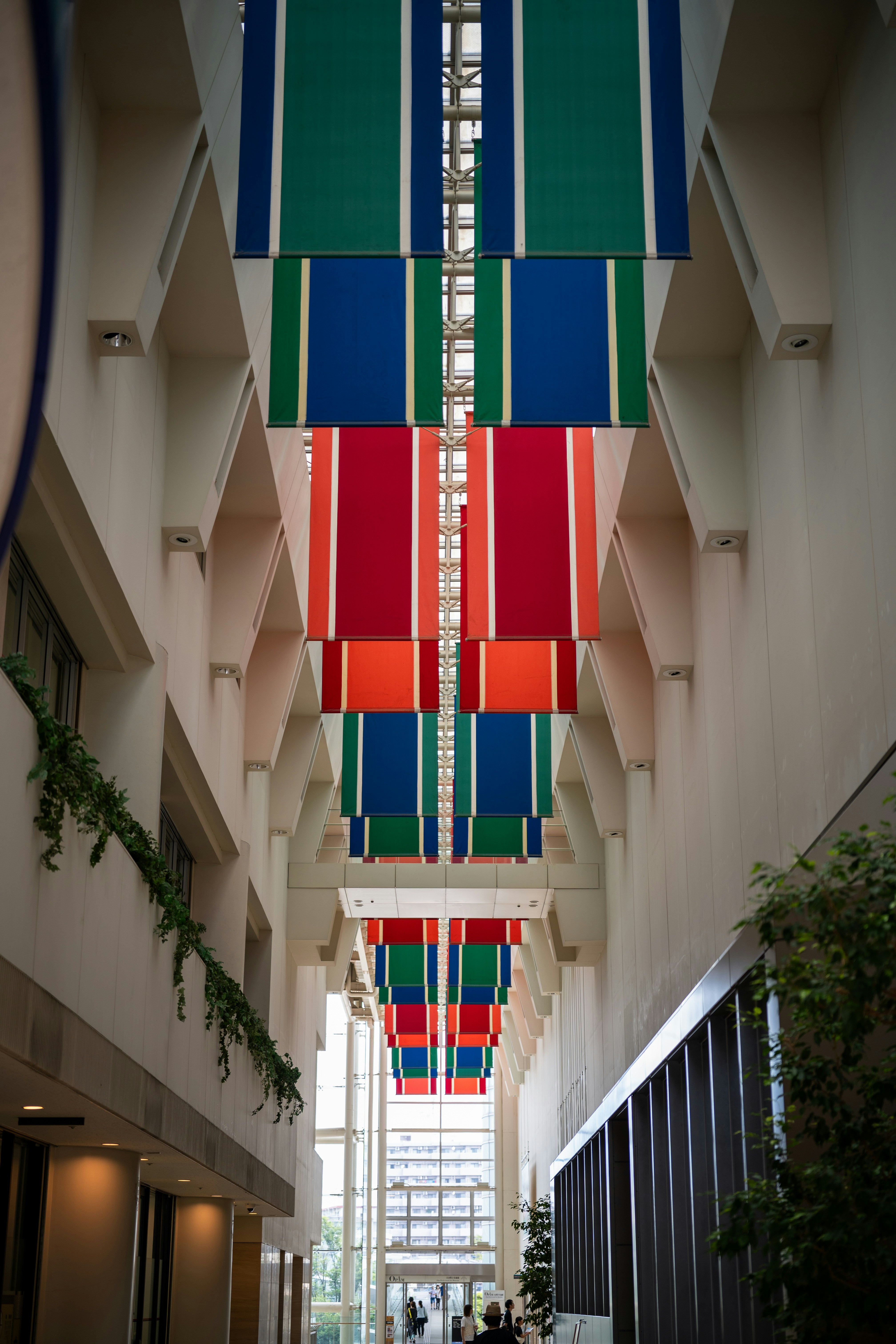 Colorful banners hang inside a bright corridor. photo – Free Building ...