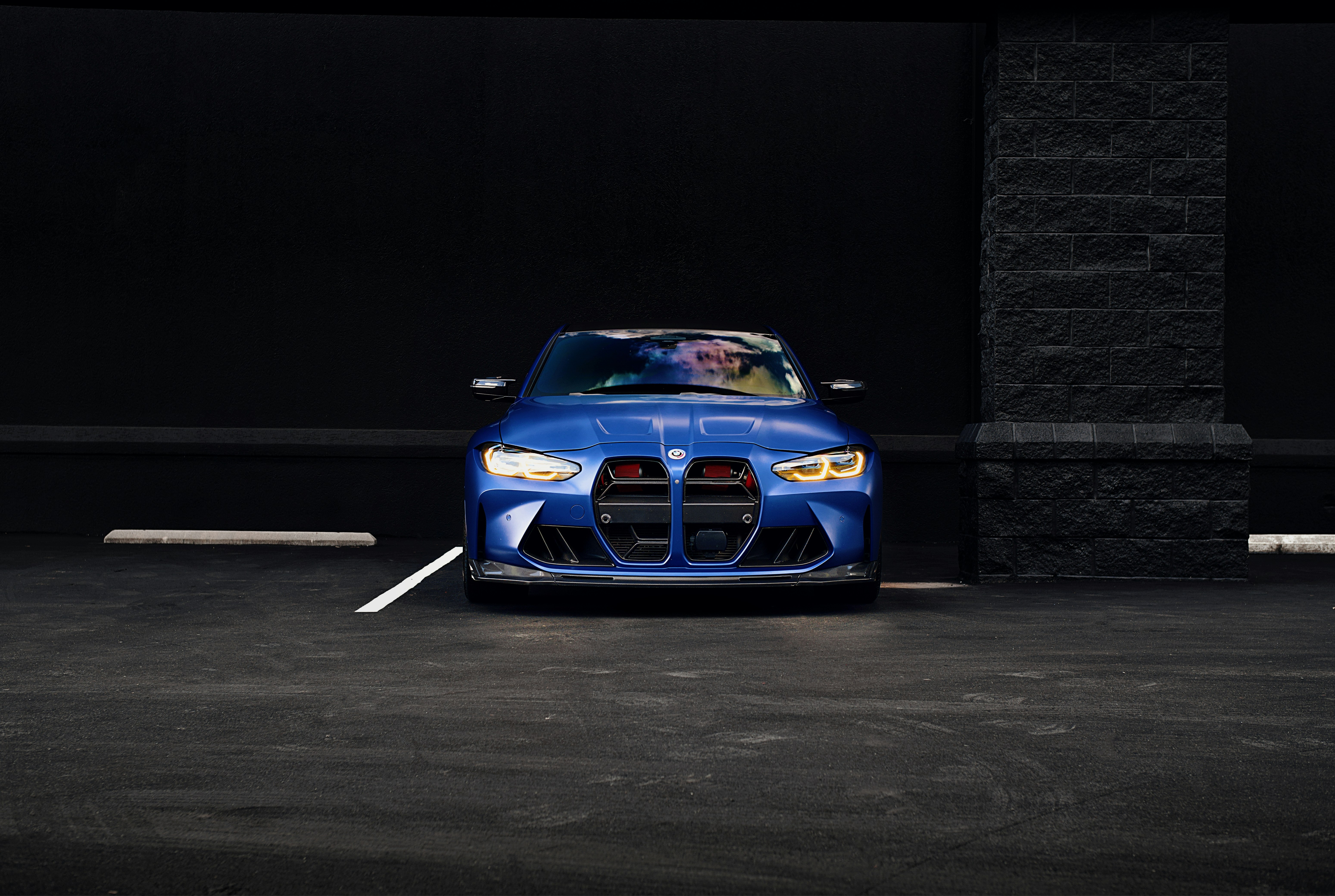 Centerframe Blue Sport Coupé in a Dim Parking Lot