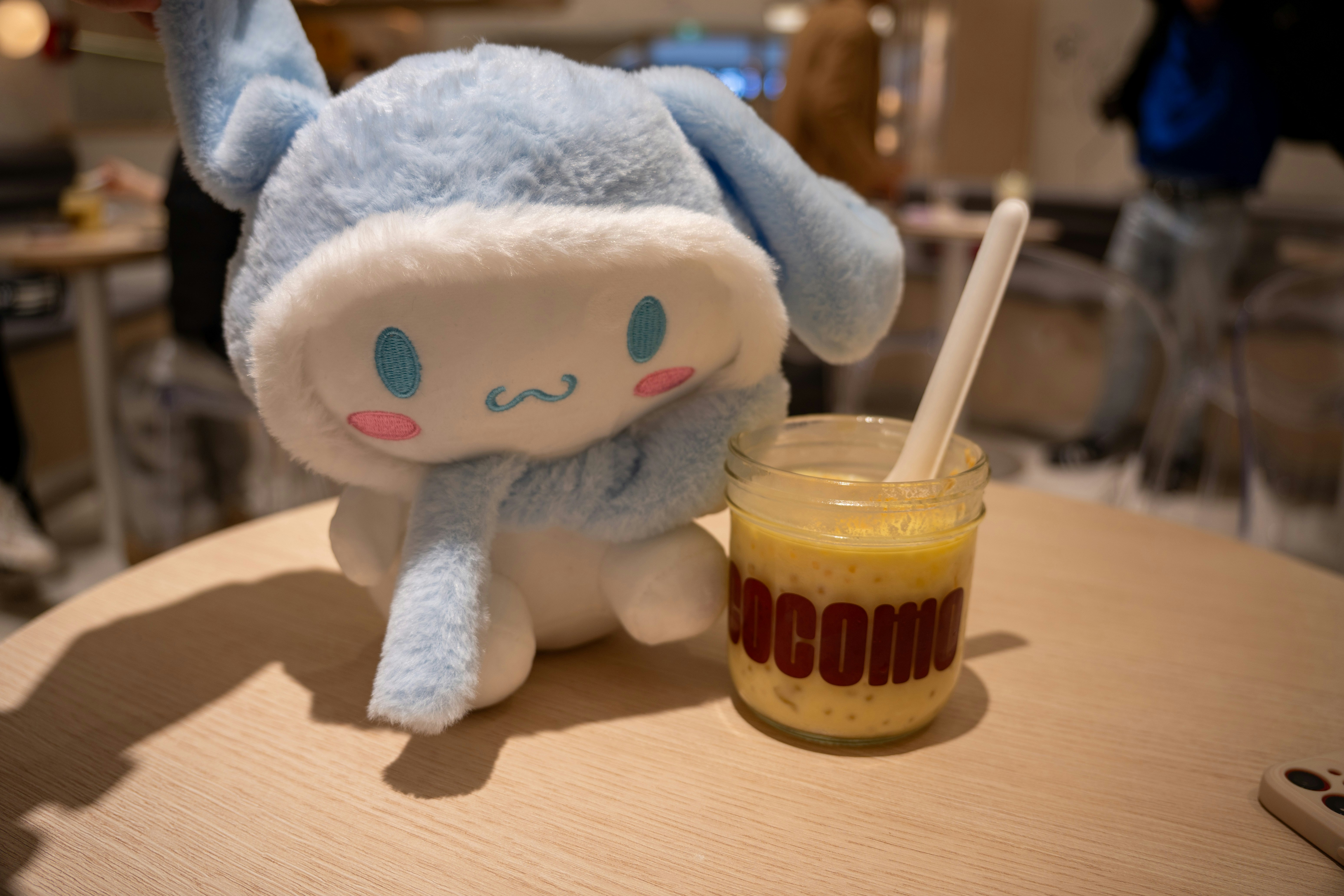 Whimsical Encounter: A Plush Companion and Creamy Delight