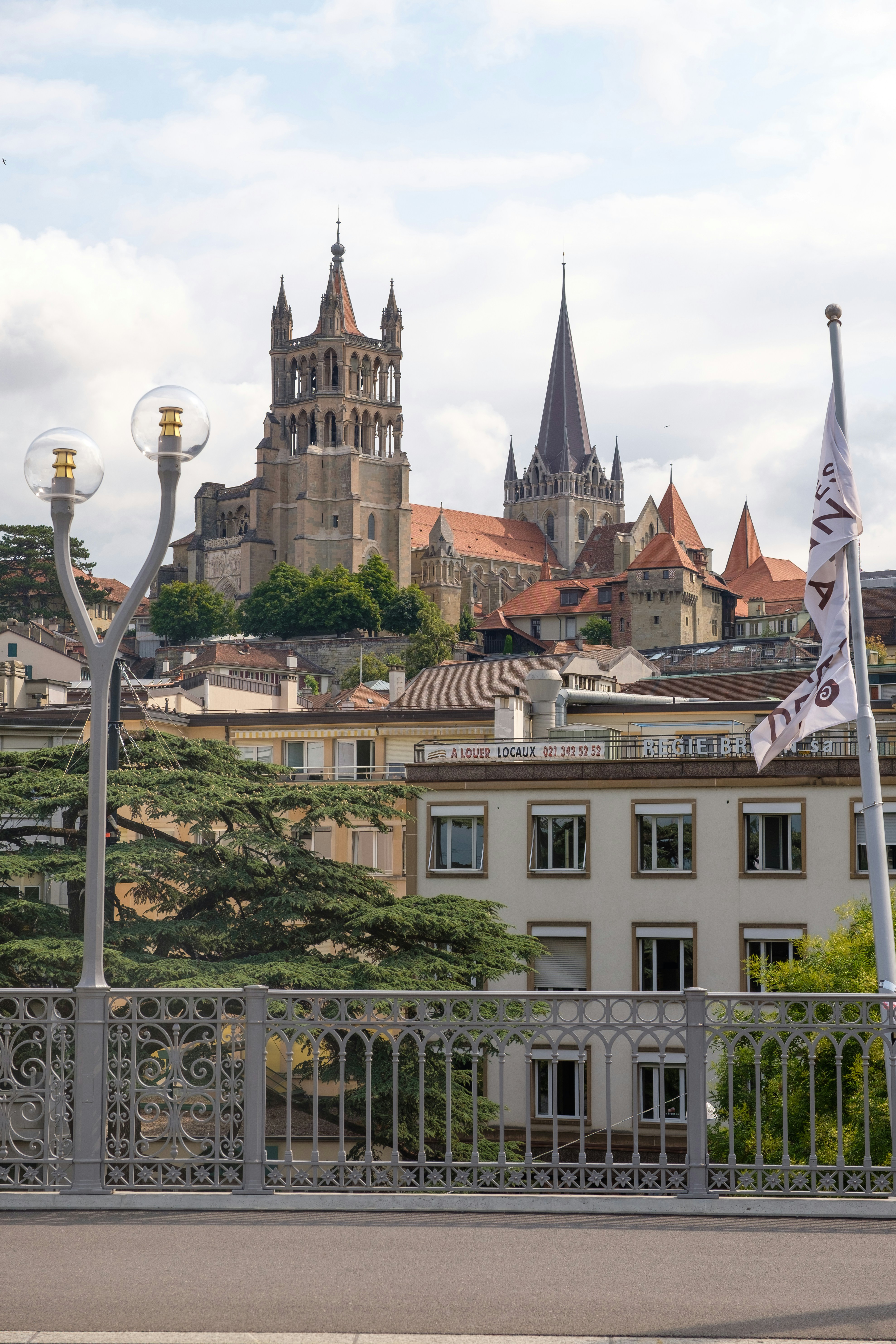 A cityscape showcases gothic architecture and modern buildings.