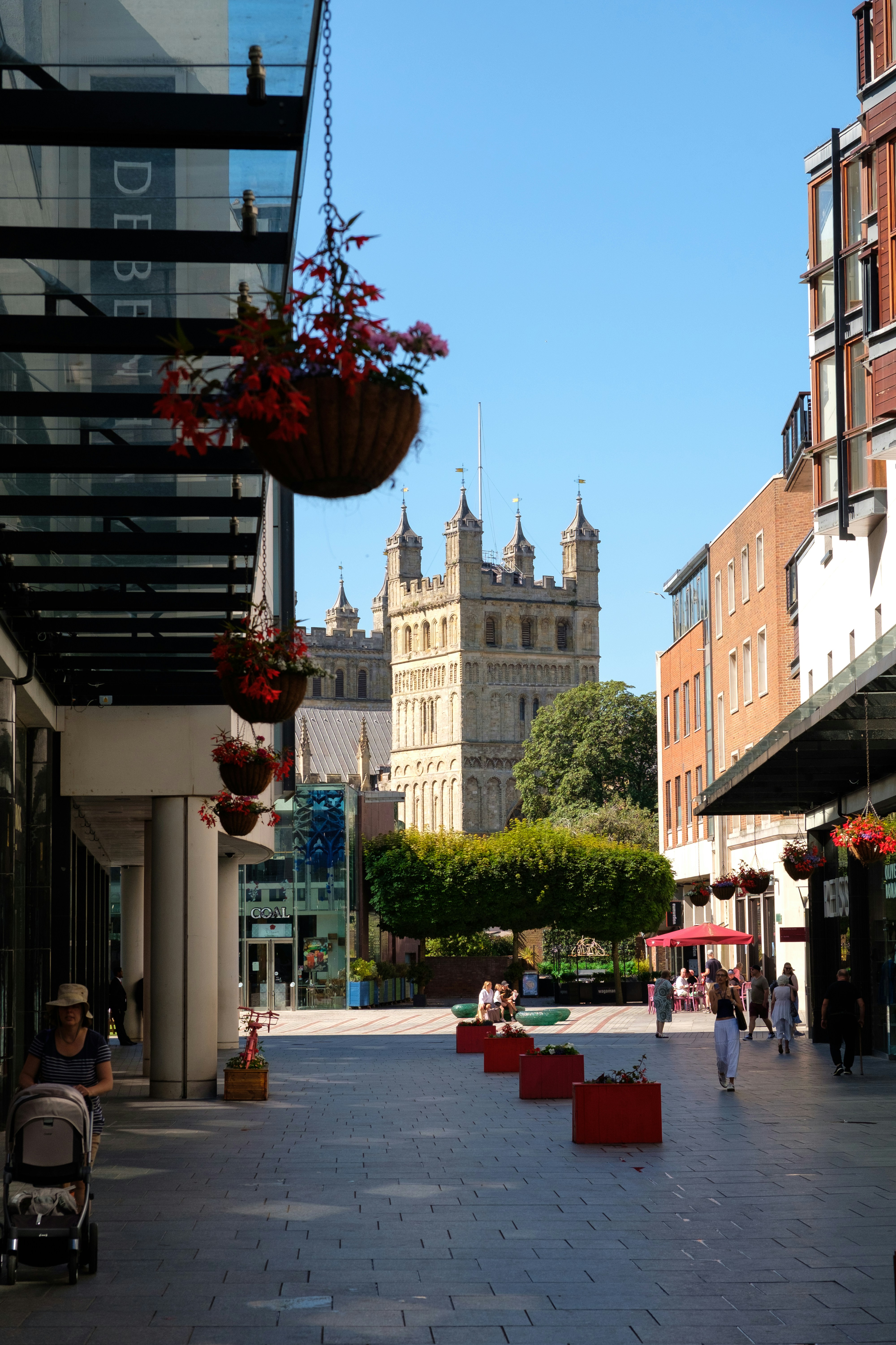 A street leads to a cathedral in the distance.