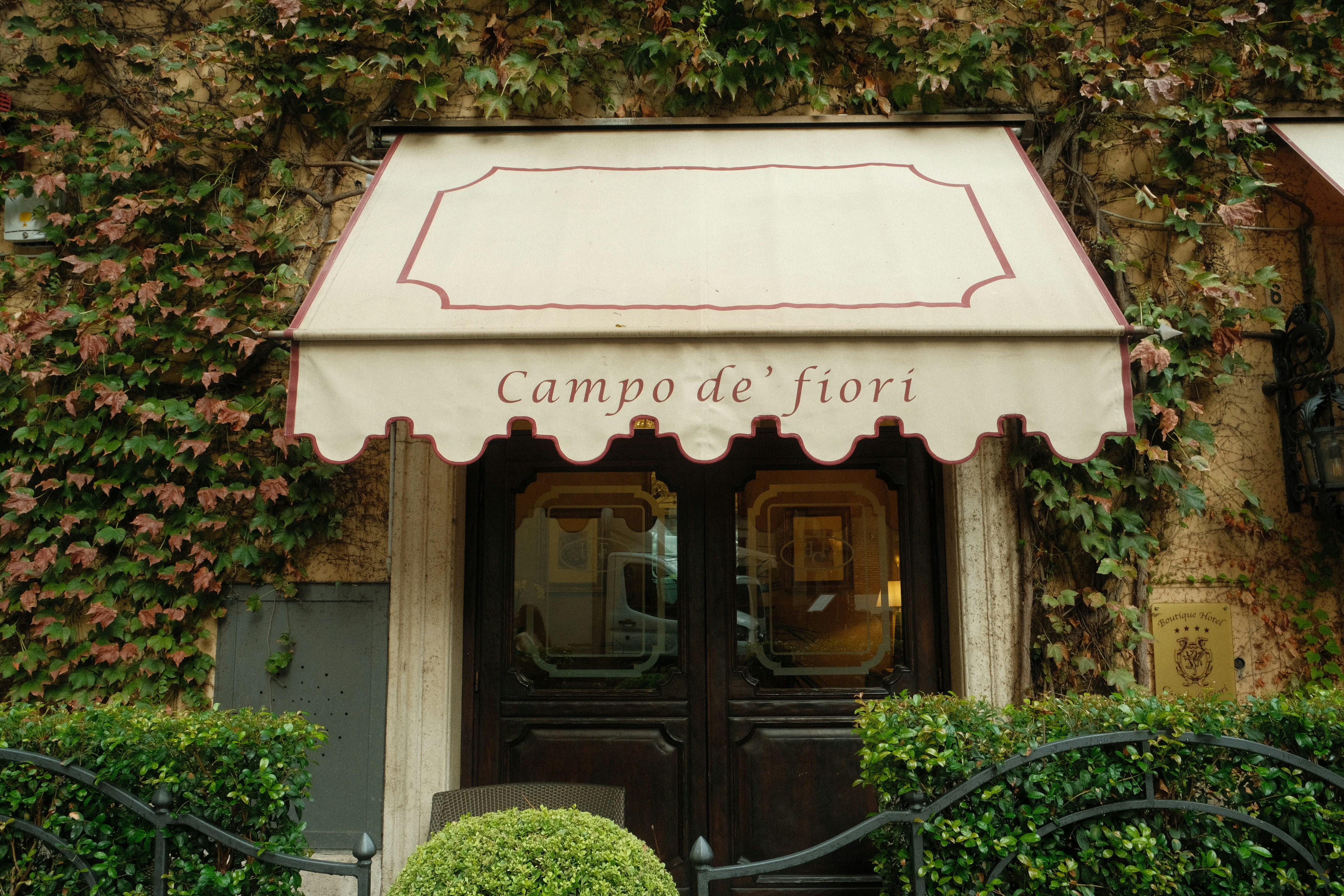 Ivied Entrance at Campo de' fiori: A Quiet Doorway Framed by Greens