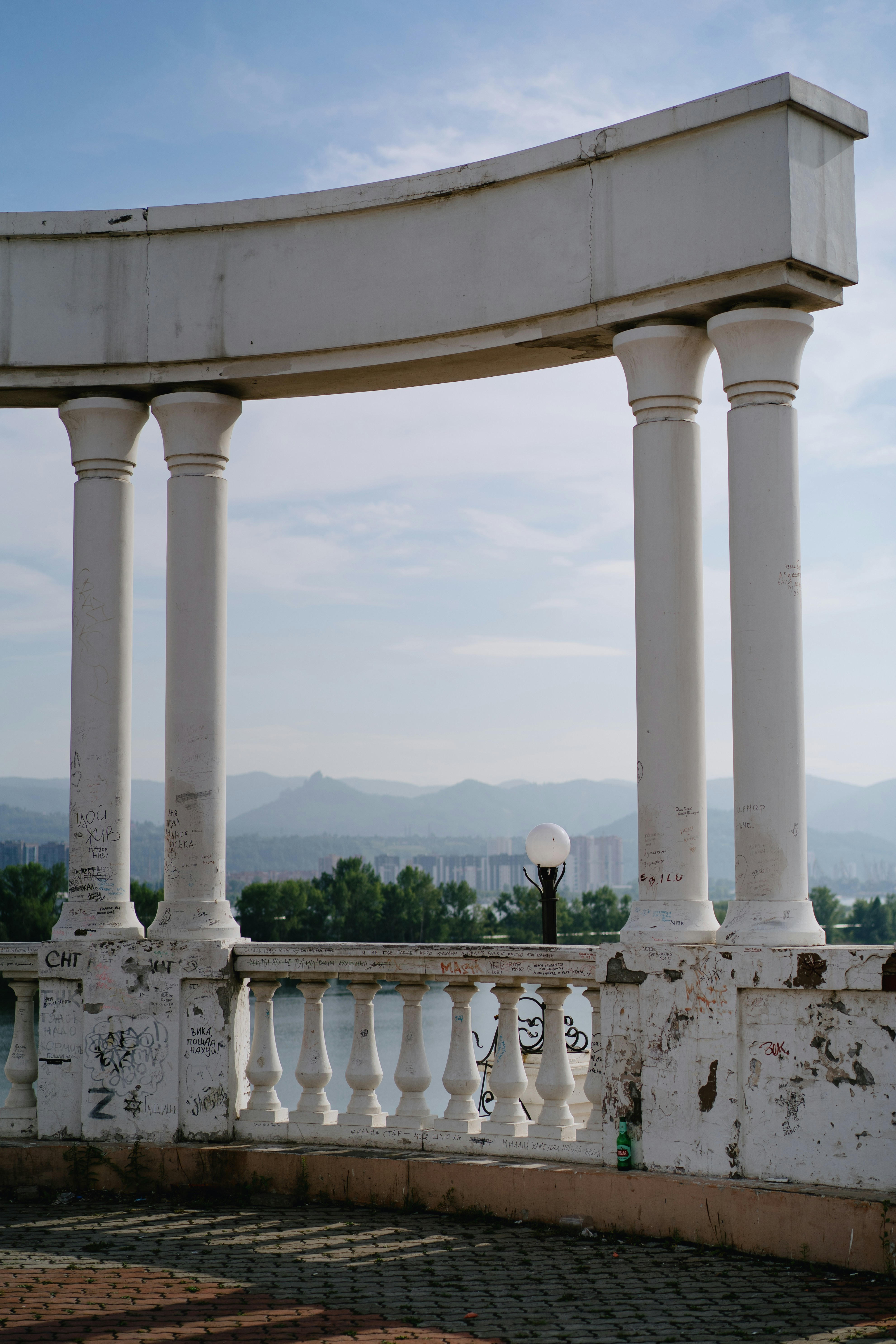 Framed Serenity: A View Through Timeworn Columns