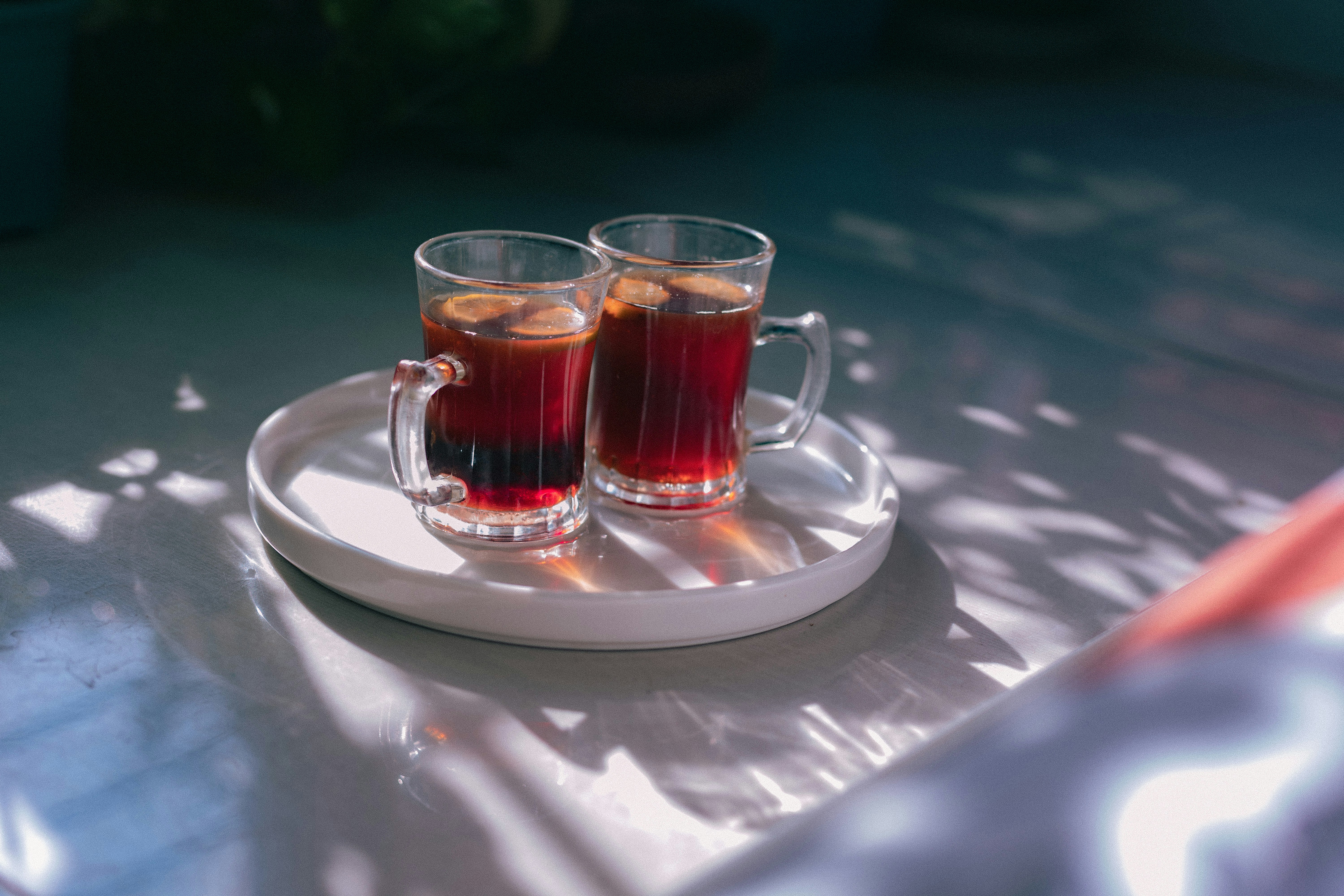 Two iced drinks sit on a white tray.