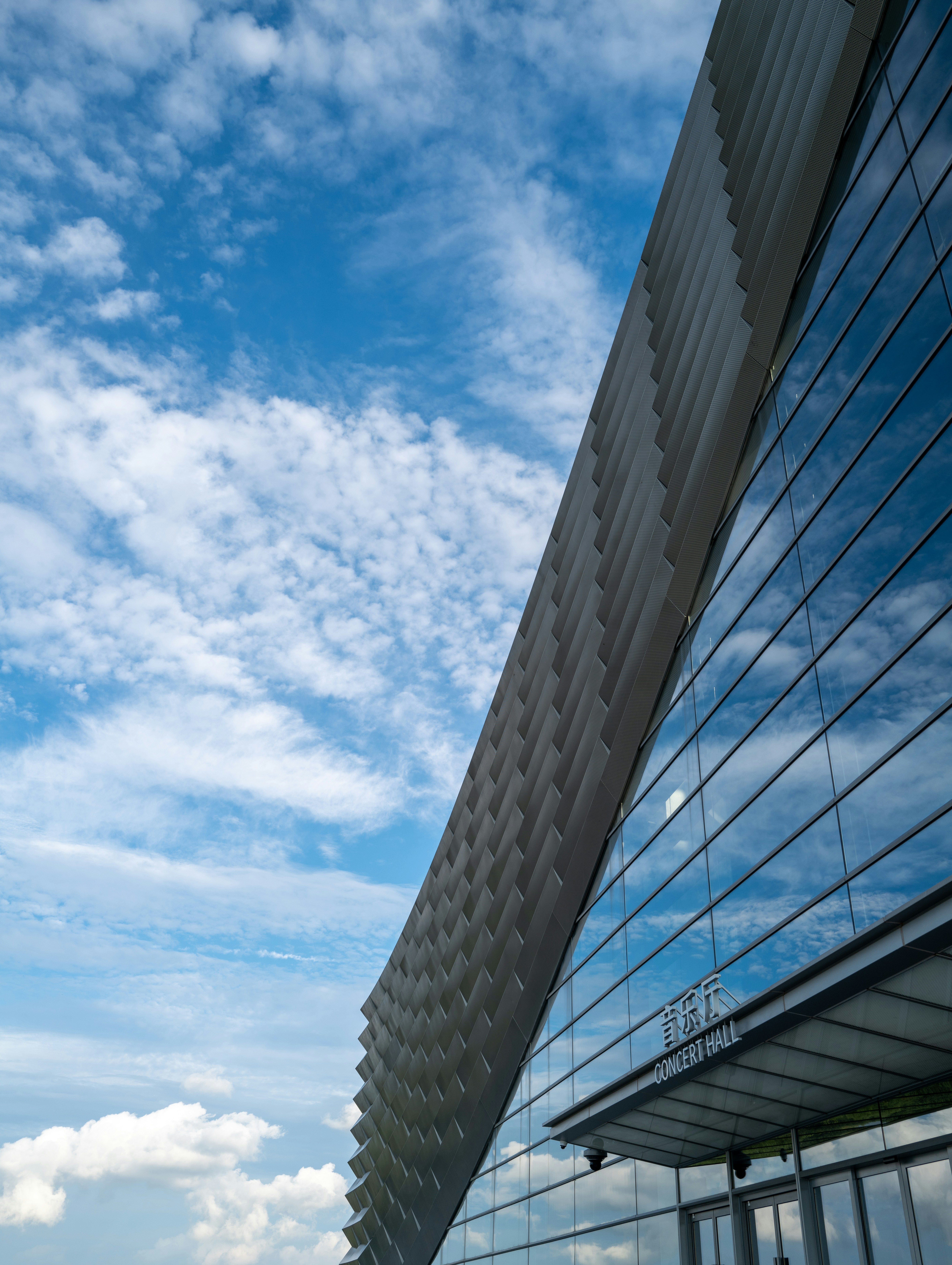 Modern building reflects the beautiful sky.