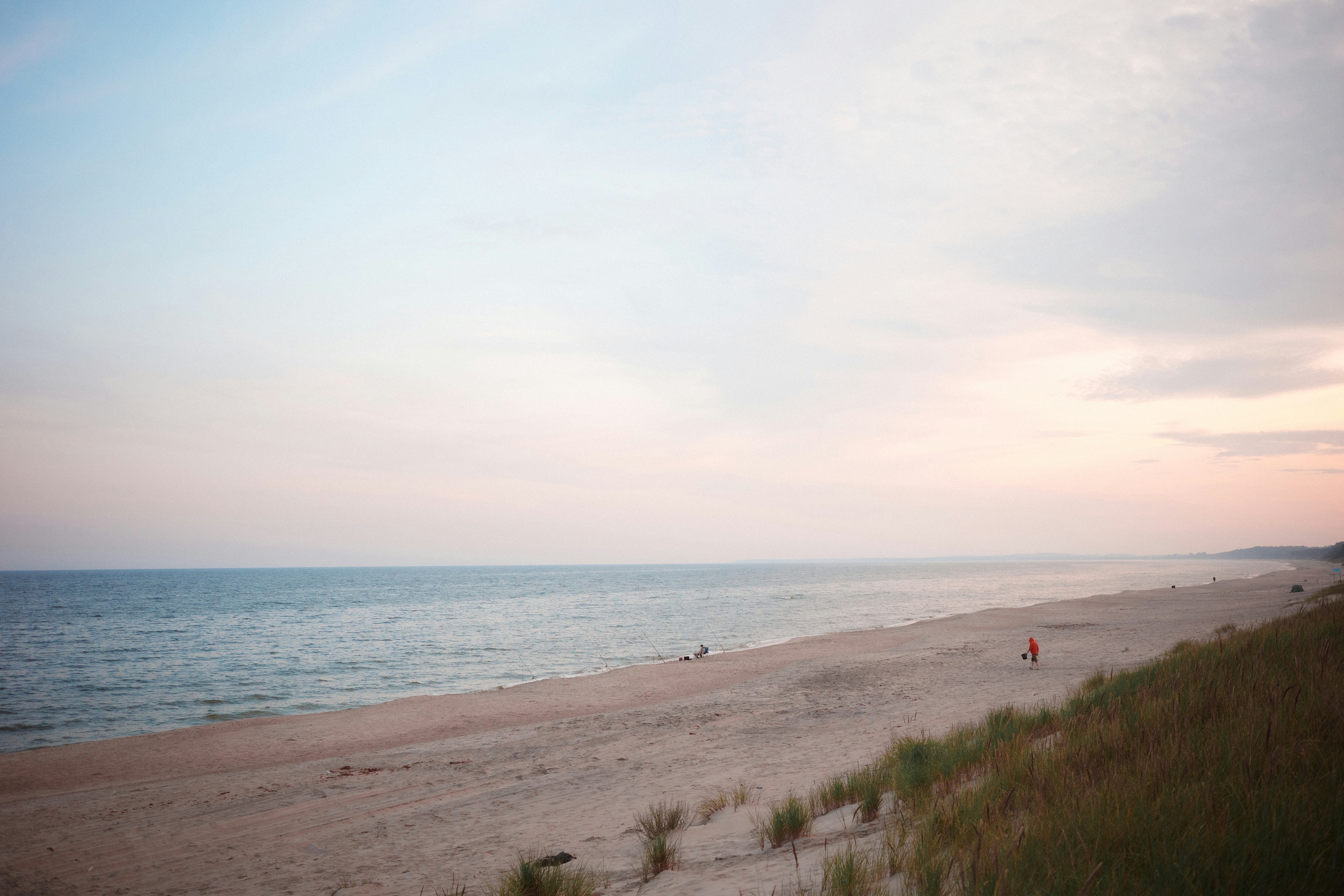 A serene beach scene under a pastel sky. photo – Free Beach Image on ...