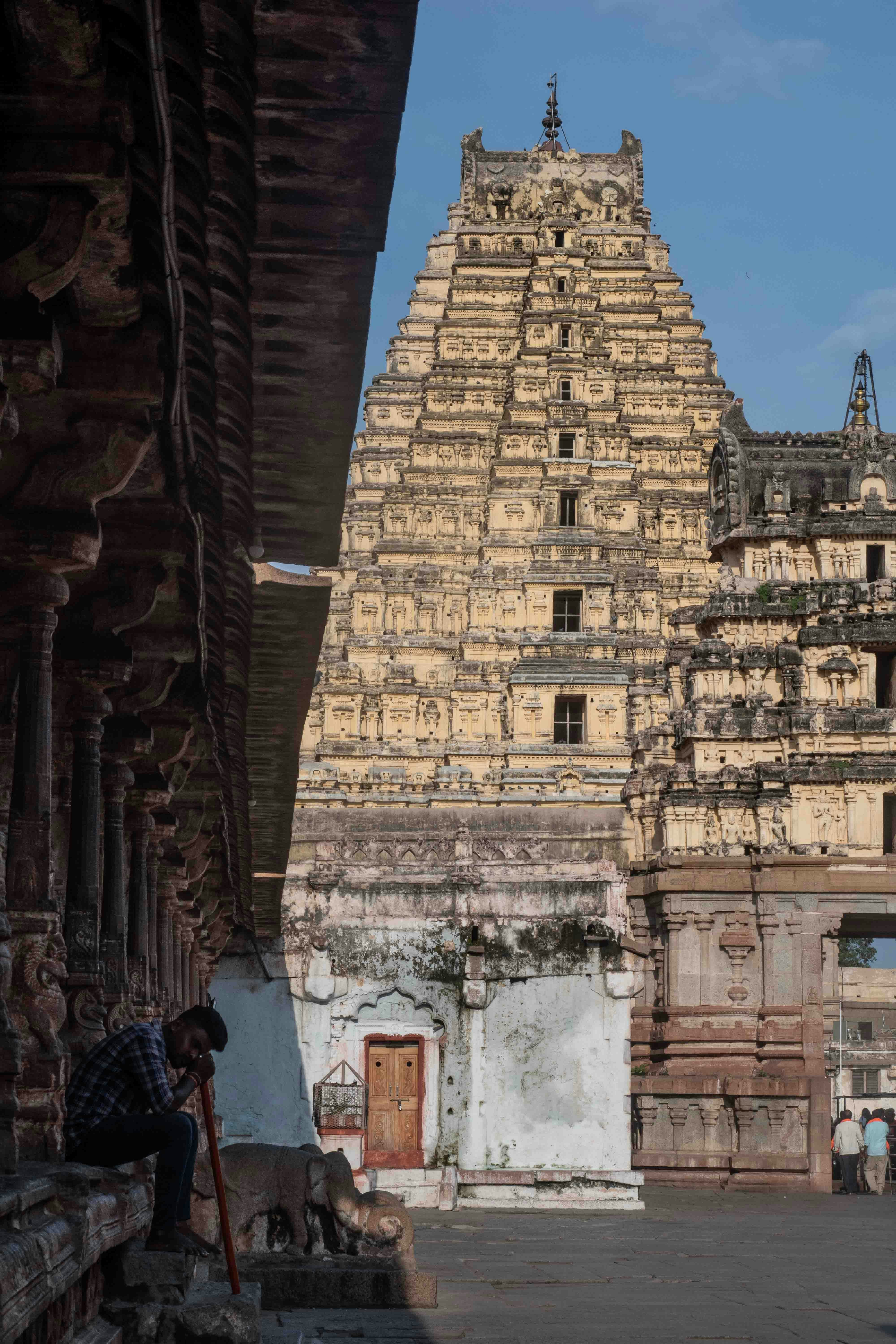 Gopuram Ascendant: Sunlit Tower Framed by Shadowed Colonnade