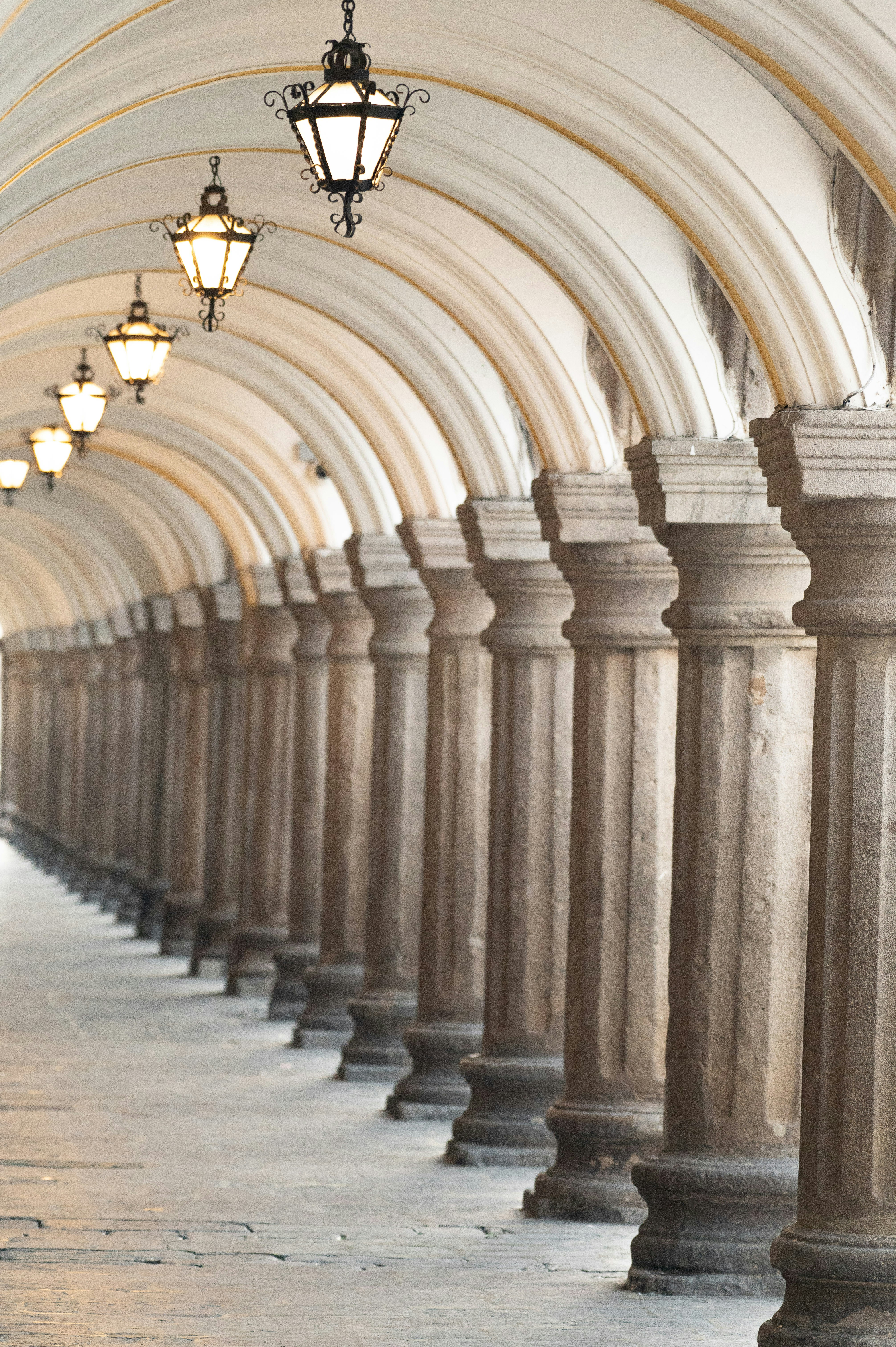 Row of arches with hanging lanterns.