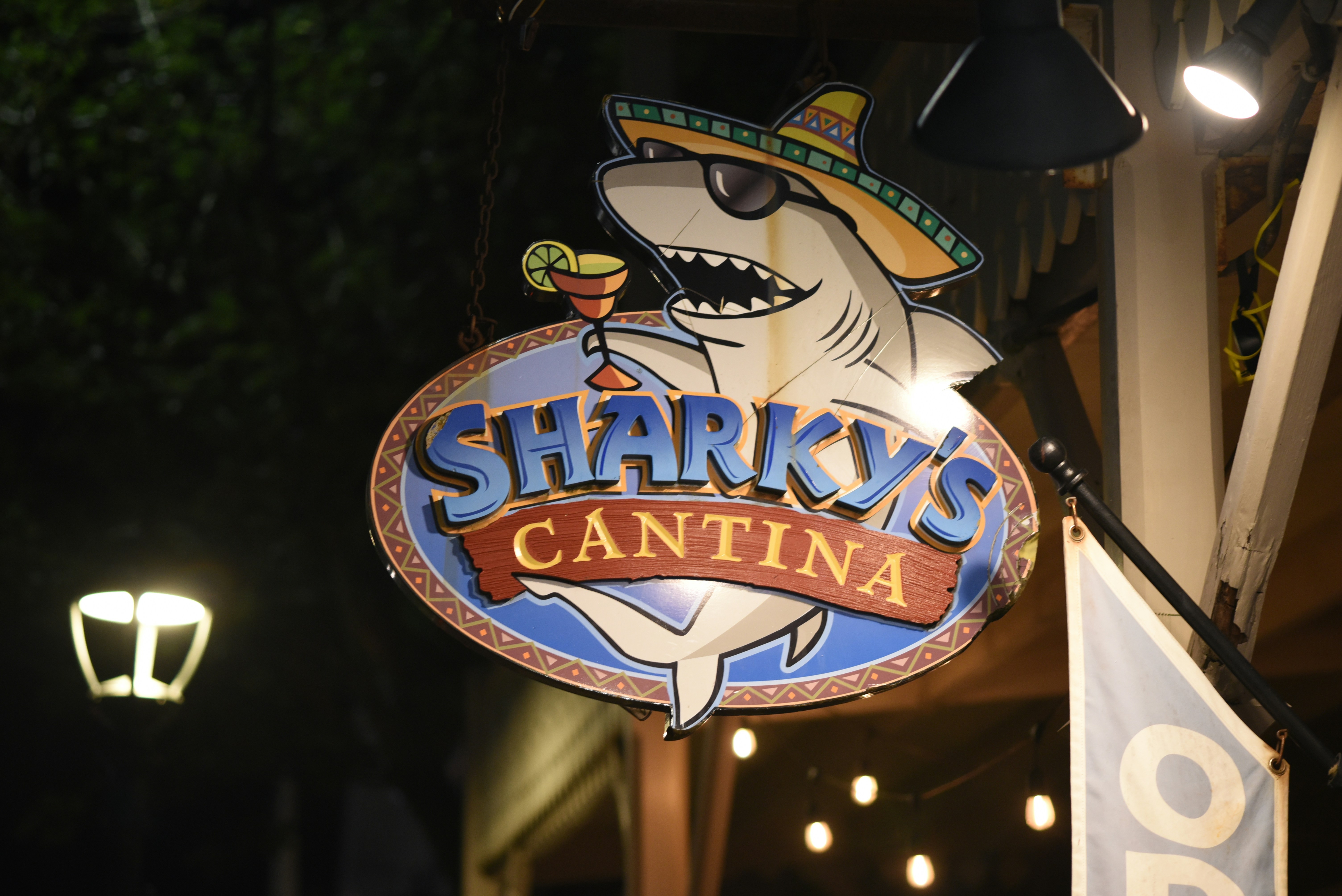 For more photos visit our website: https://mvvacation.com | Sharky's cantina restaurant sign displays a cartoon shark.