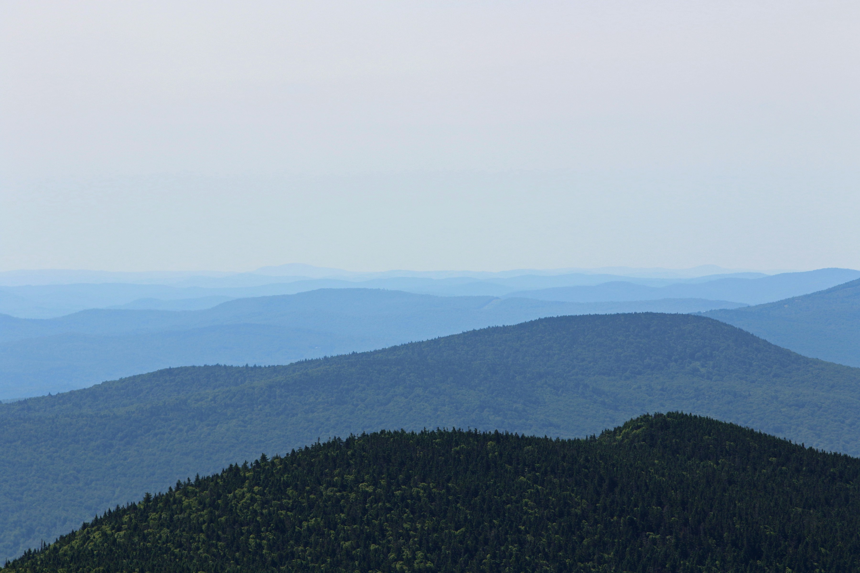 Mountains appear layered in shades of blue.
