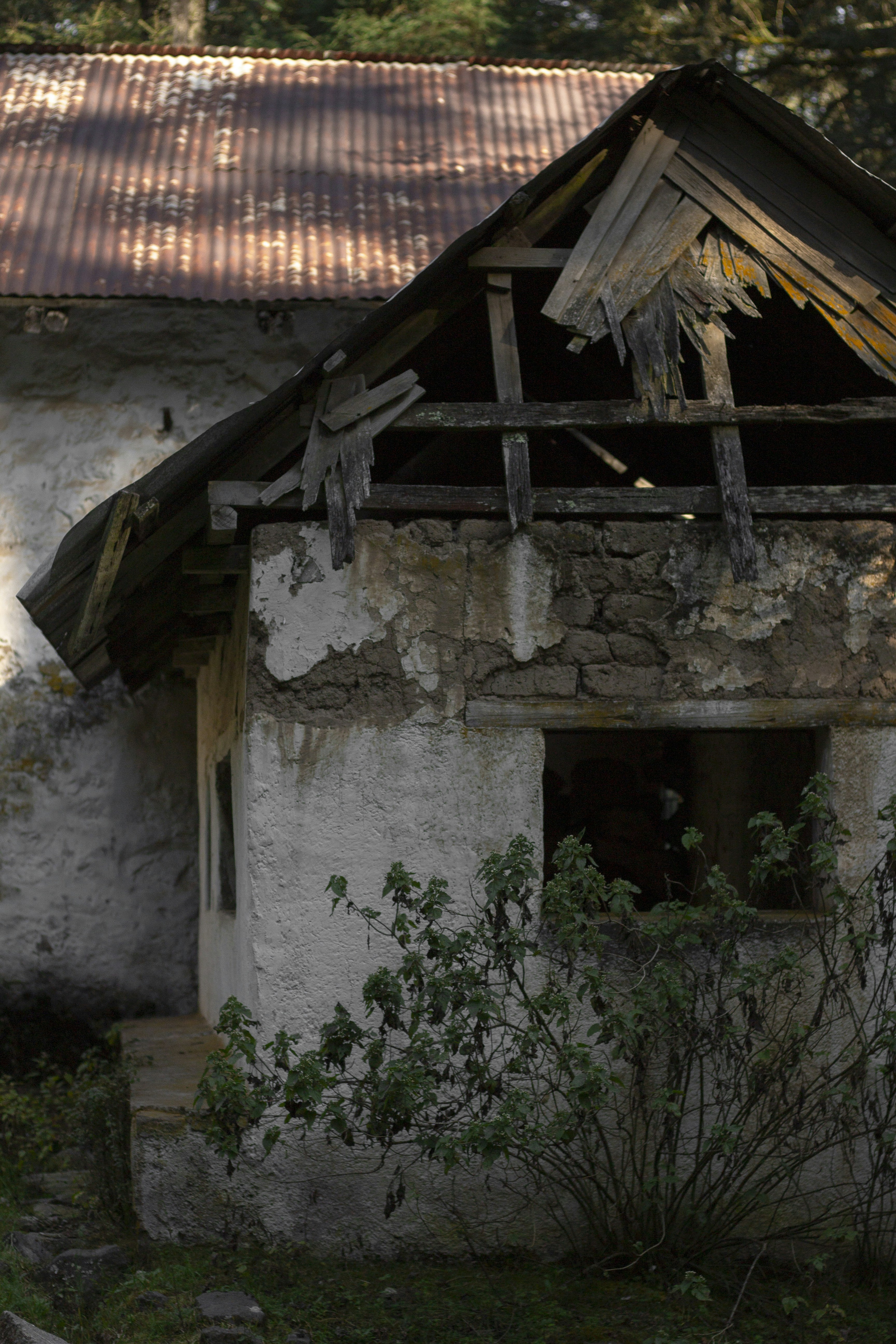 A dilapidated building shows signs of decay.