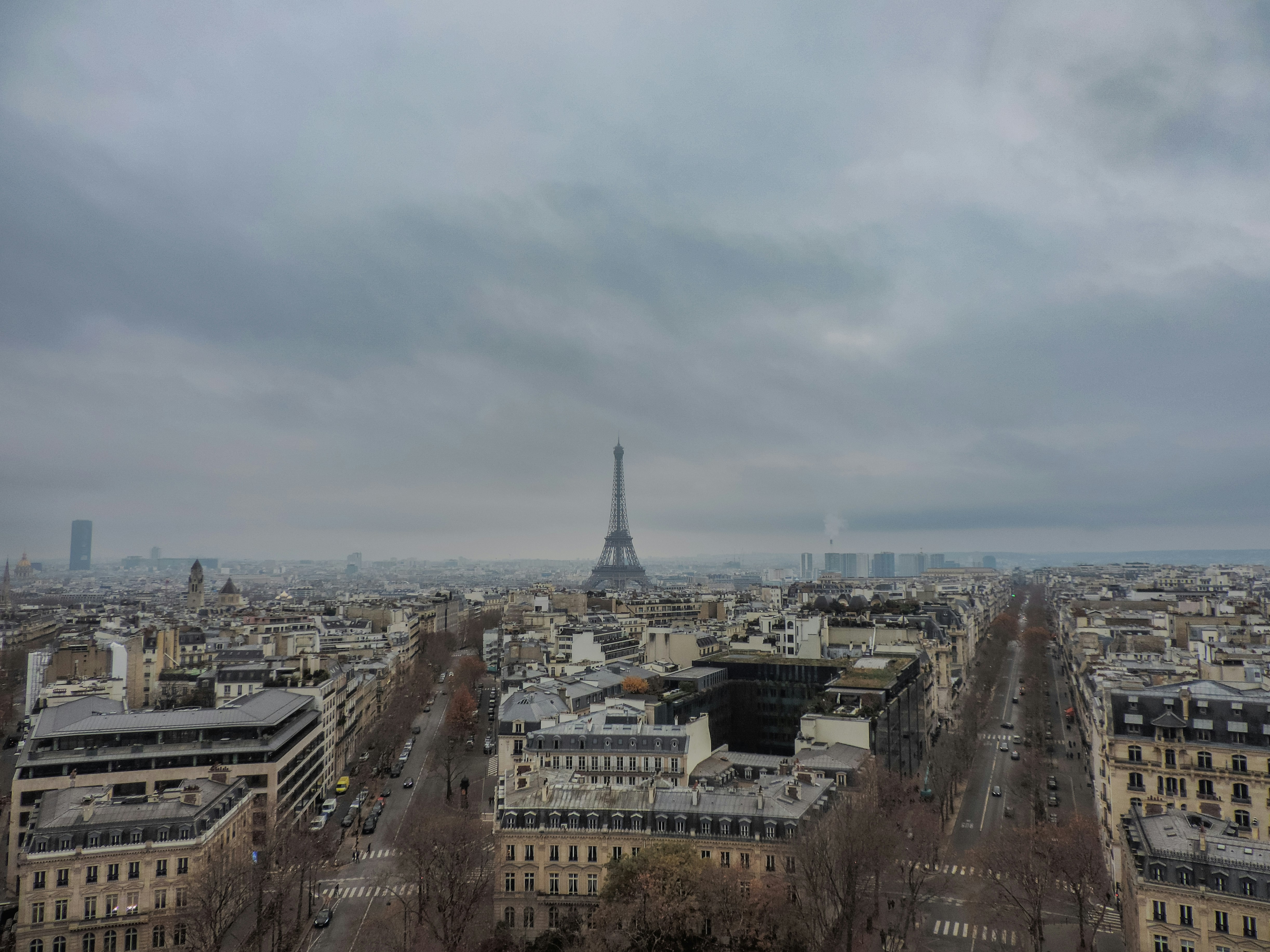 Whispers of Paris: A City Beneath Cloudy Skies
