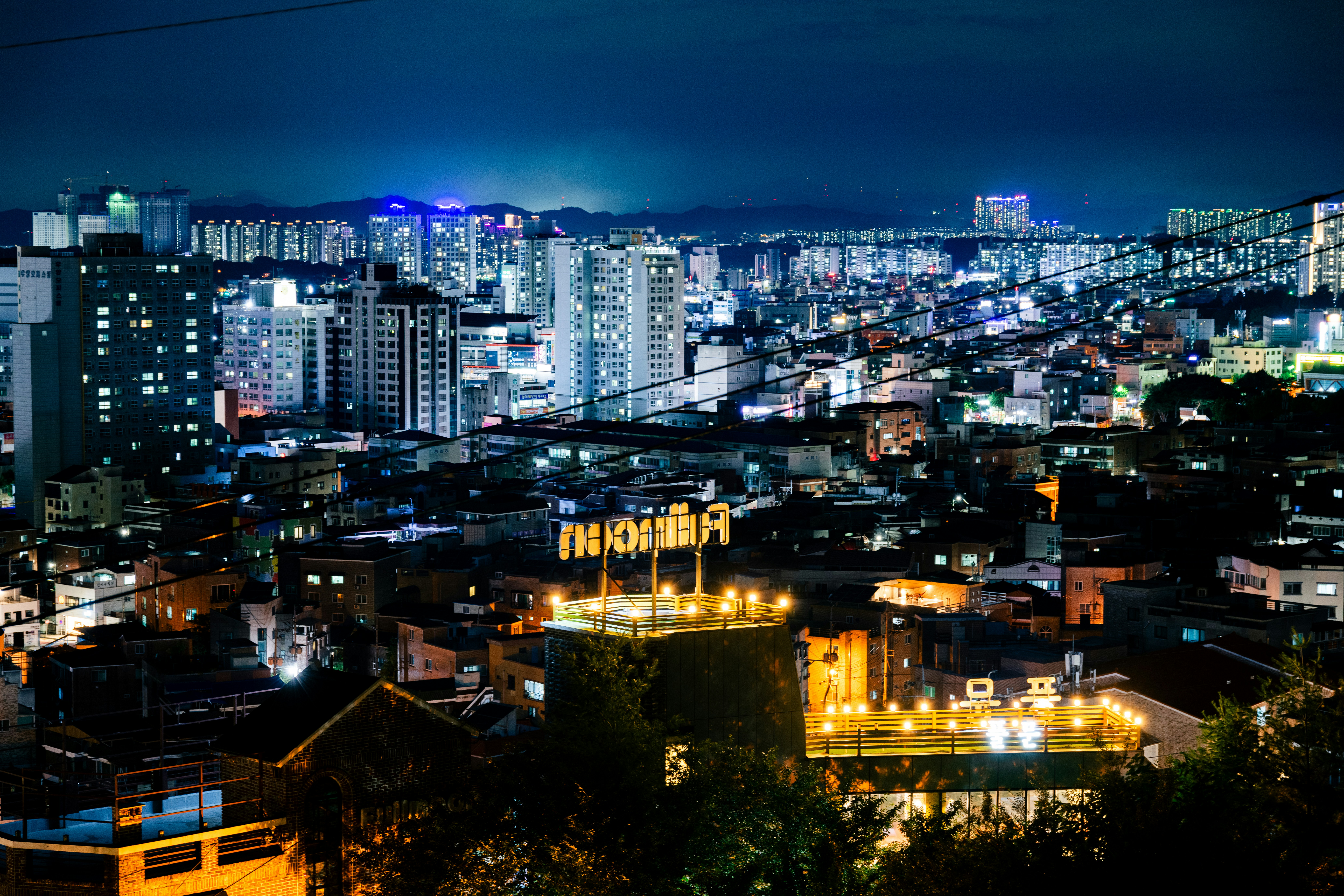 City lights illuminate the night sky.