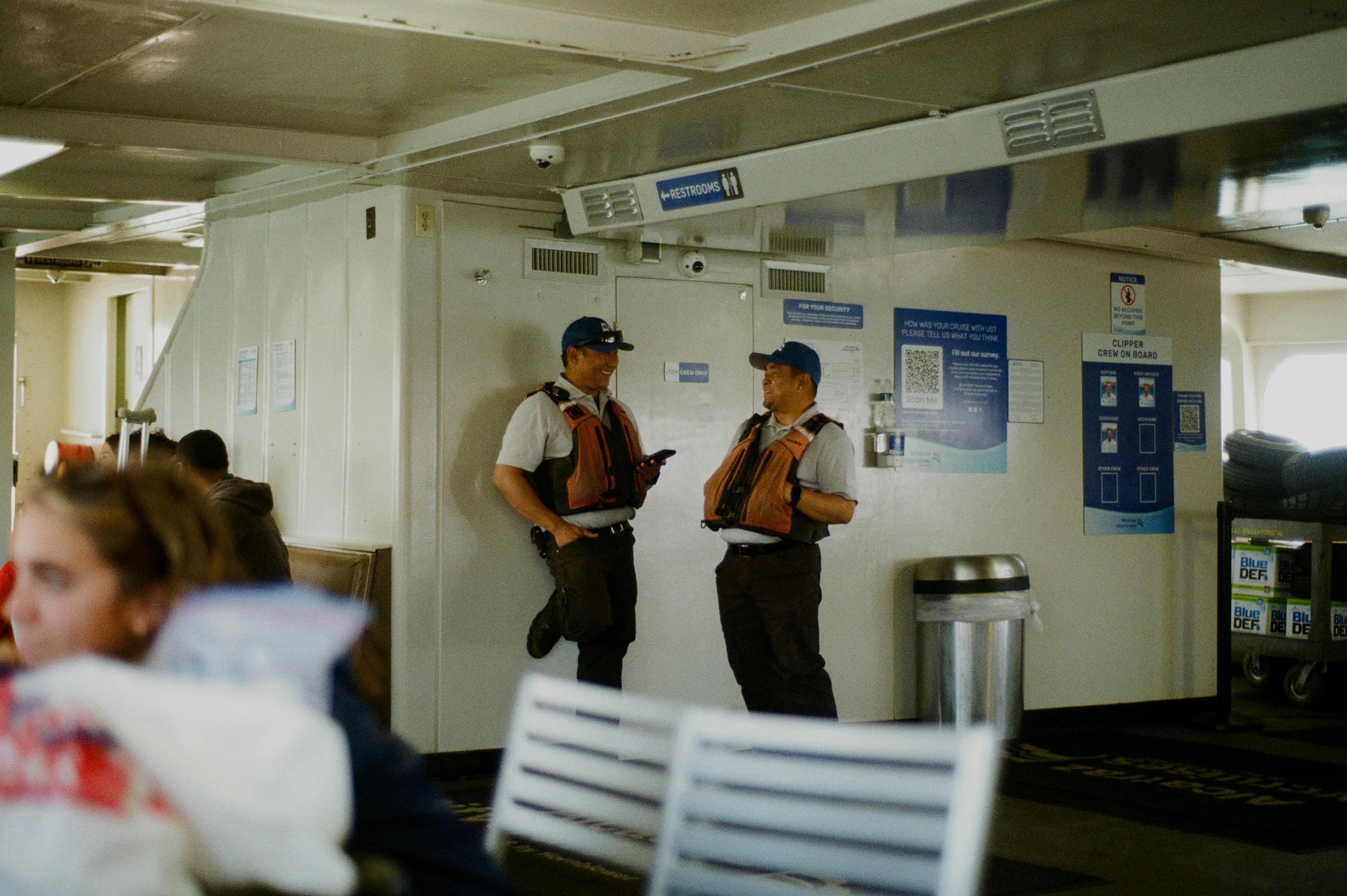 Two workers in uniform are standing inside. photo – Free Girl Image on ...