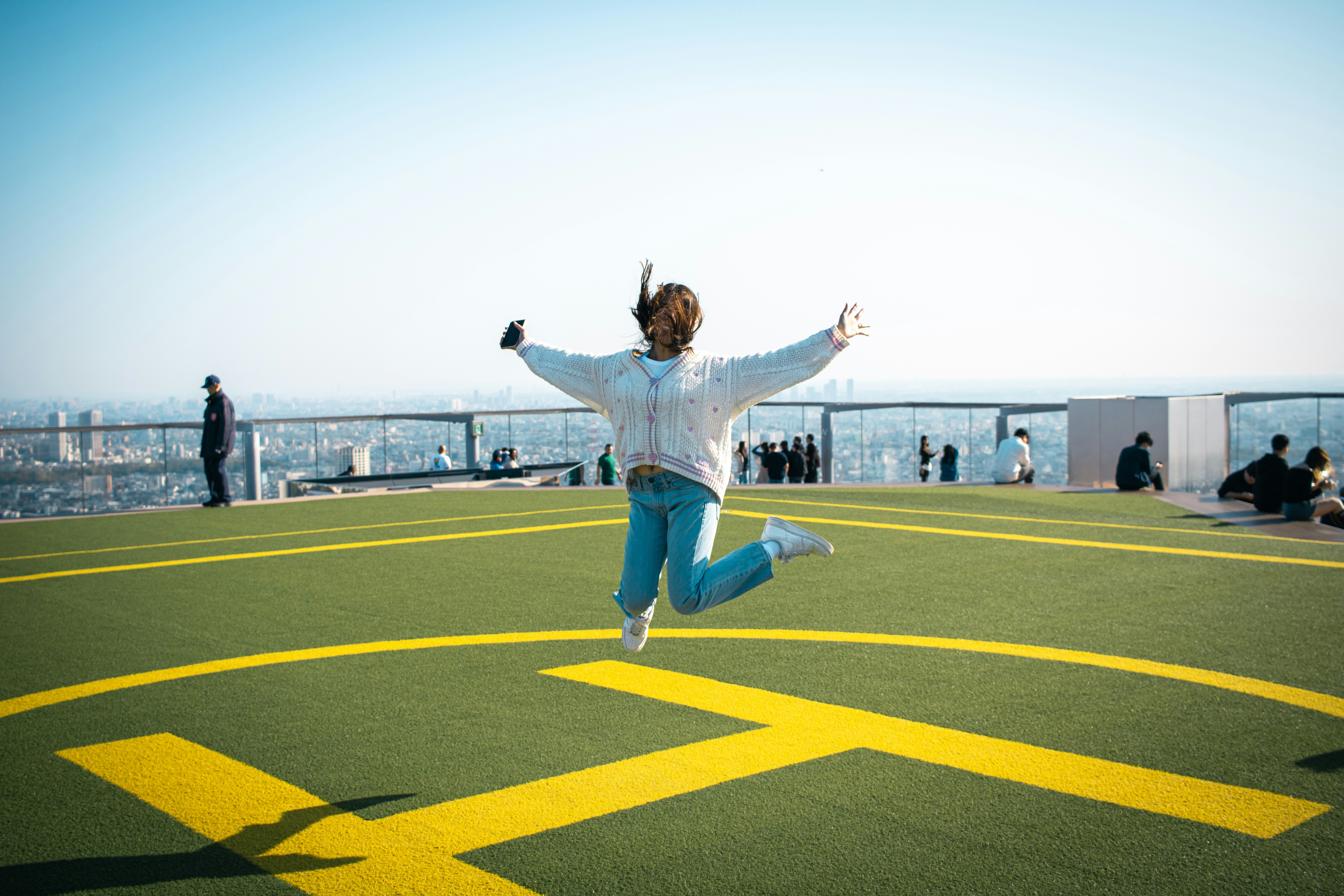 Elevated Joy: A Leap Above the Cityscape
