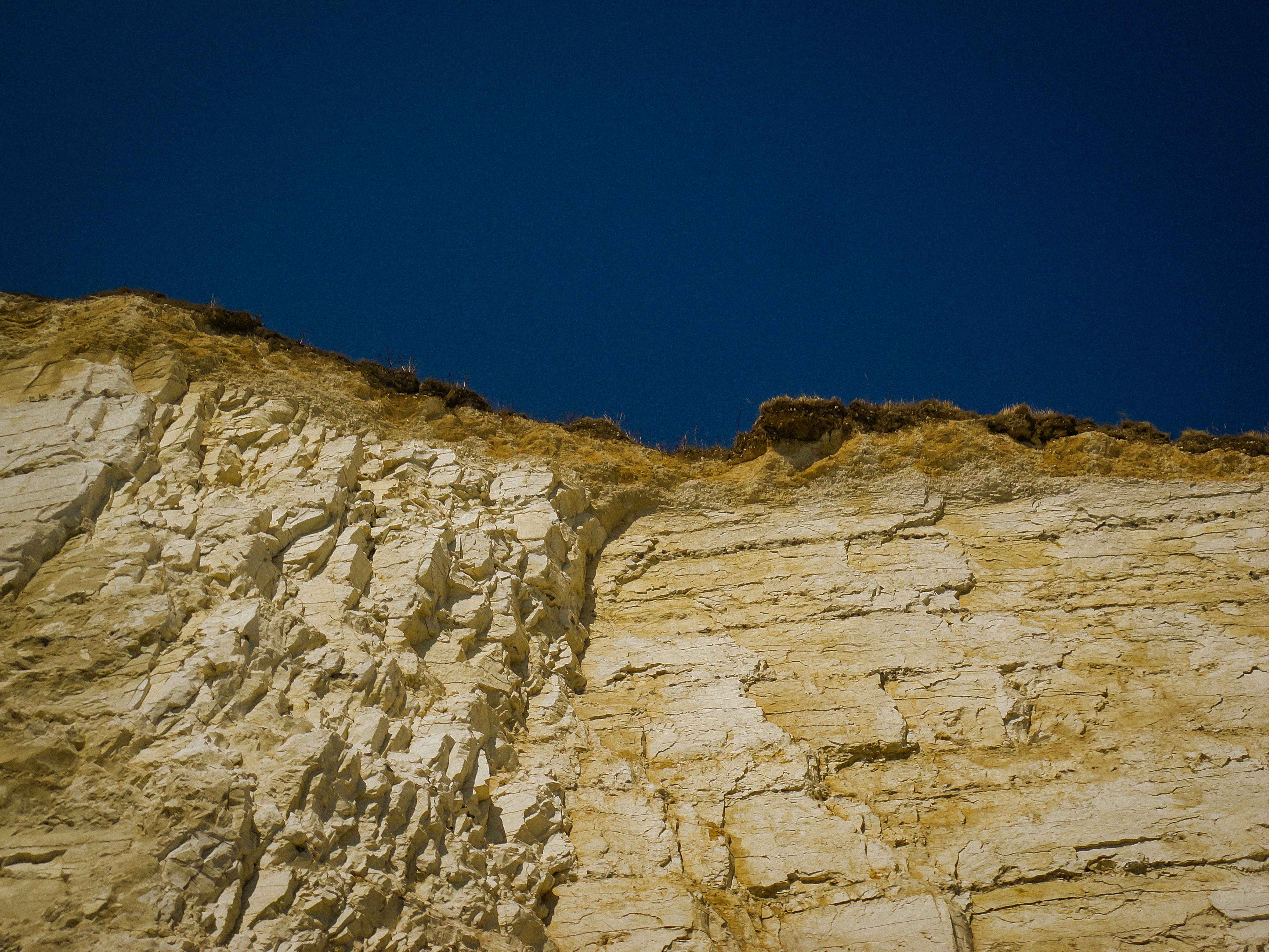 White cliffs against a clear blue sky.
