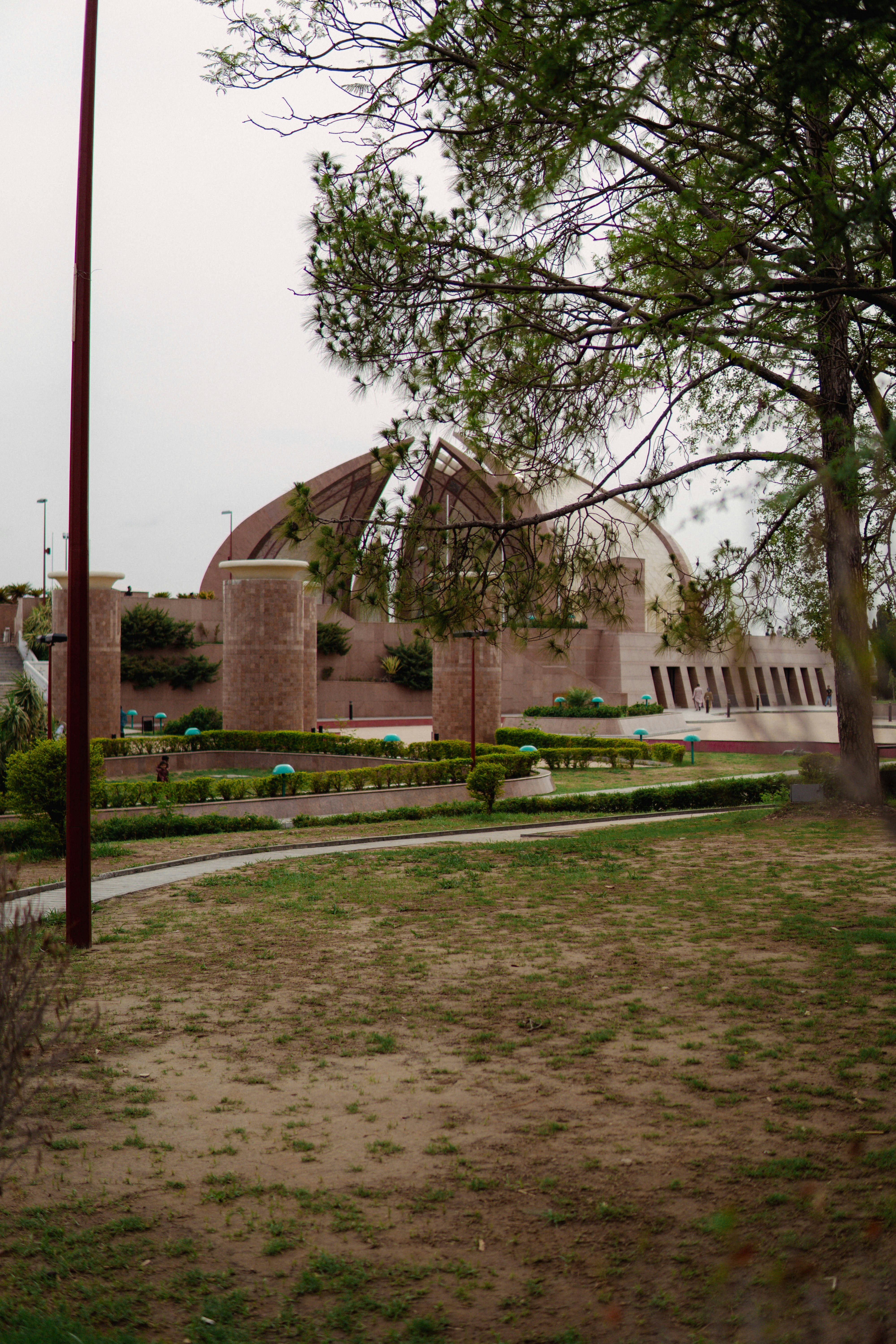 A grand monument sits in a green landscape.