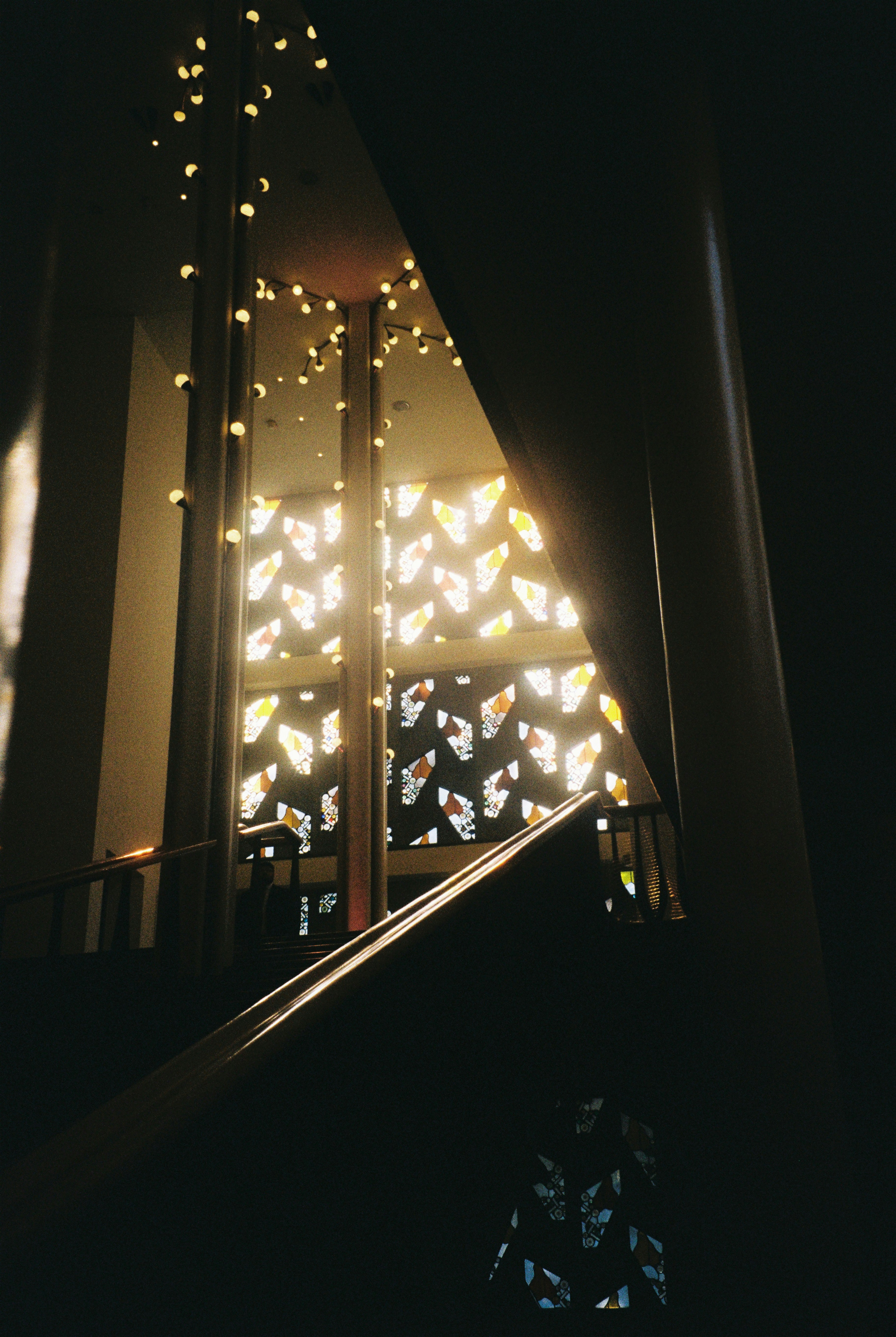 Shot on Kodak Gold 200 | Light shines through a stained-glass window.