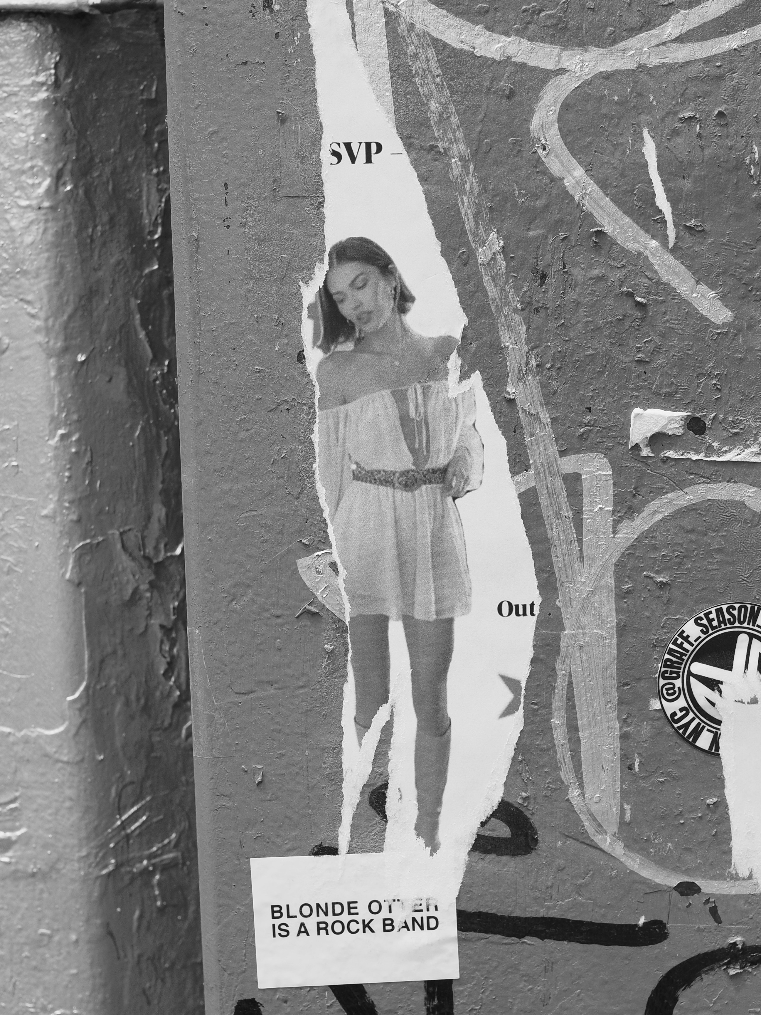 Casting a Shadow: Tape-cut Poster of a Woman on a Graffiti-Washed Wall