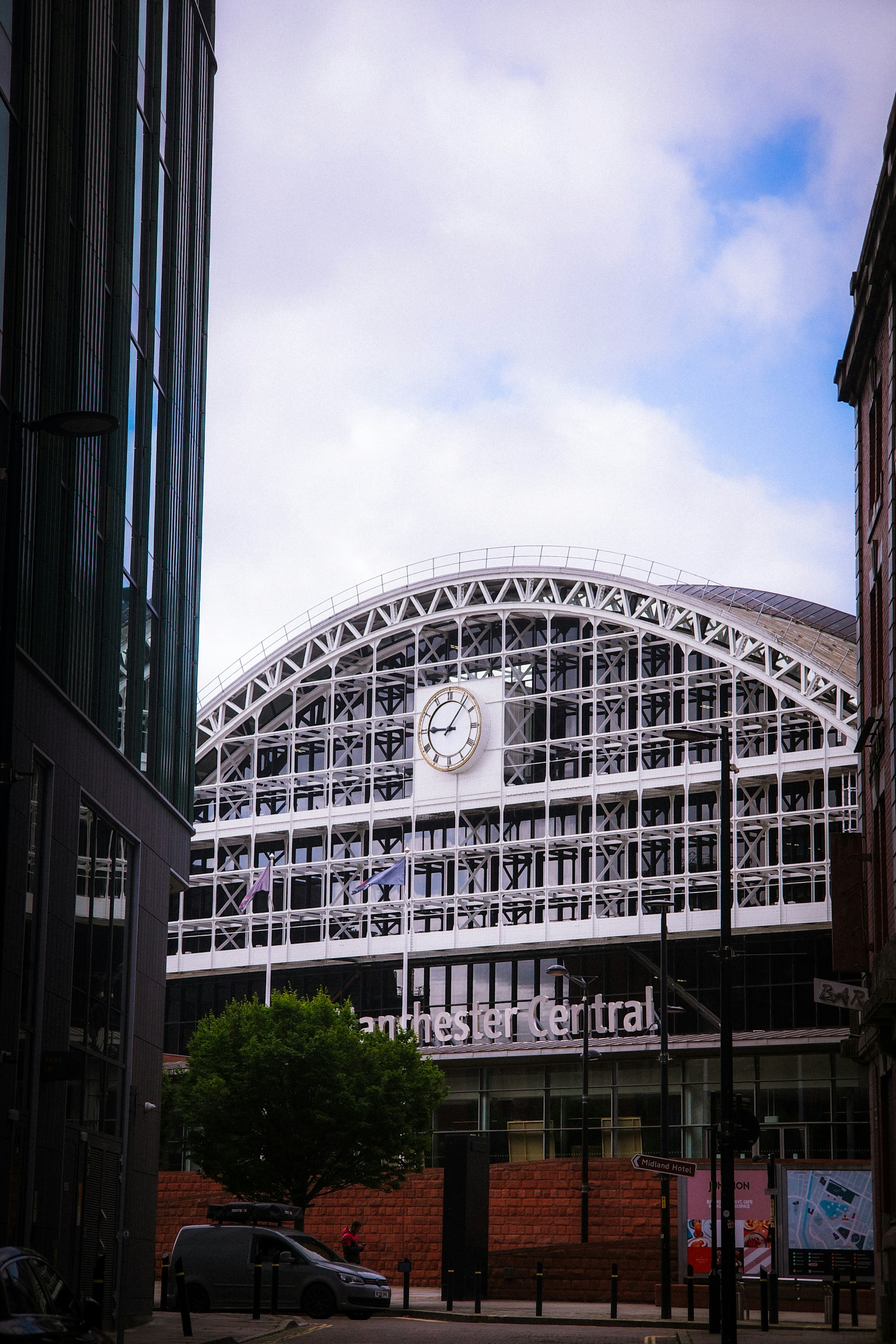 Clock Arch Over Manchester Central: Glass, Steel and Sky
