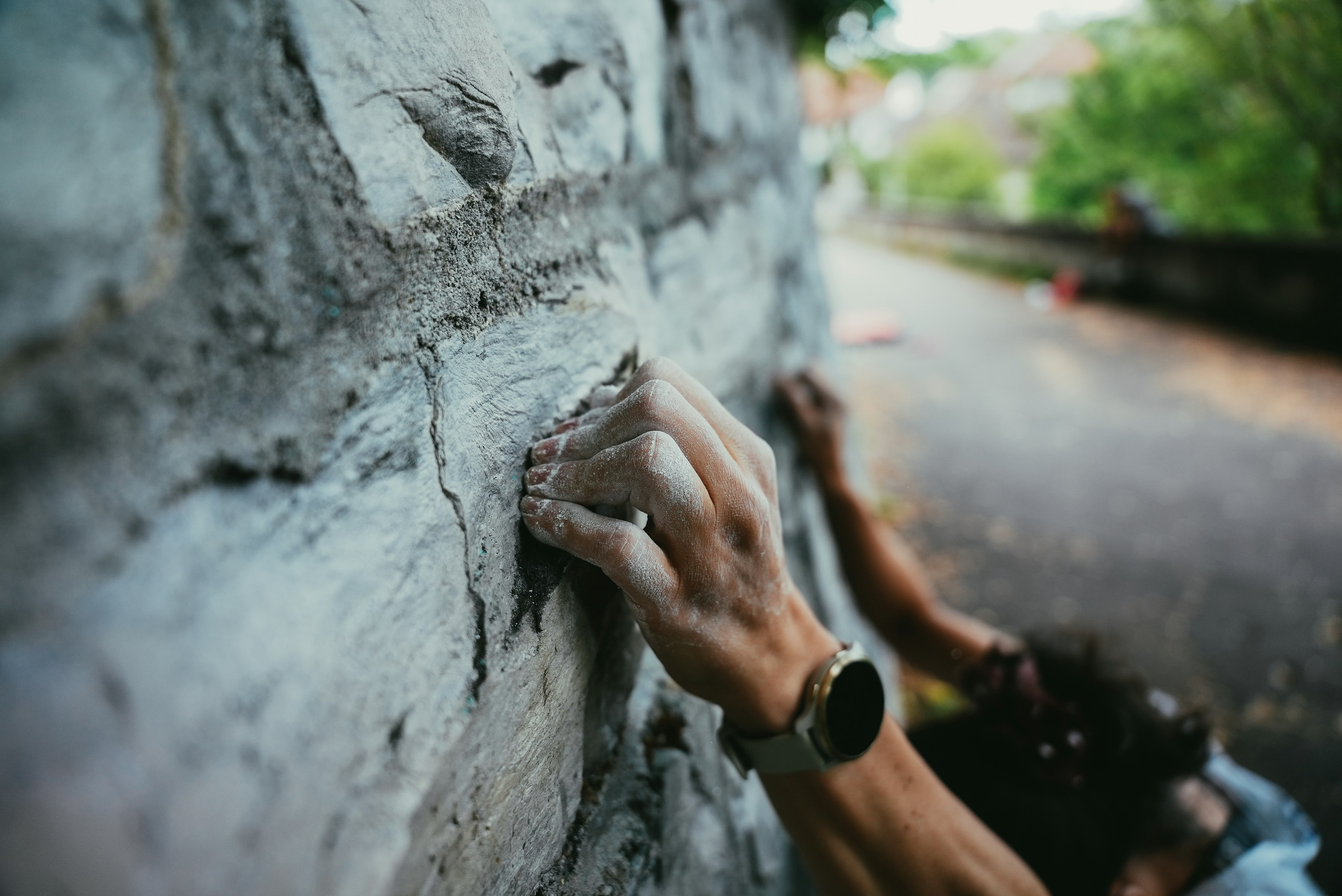 Climber's hands gripping a rough, stone wall. photo – Free Hands Image ...