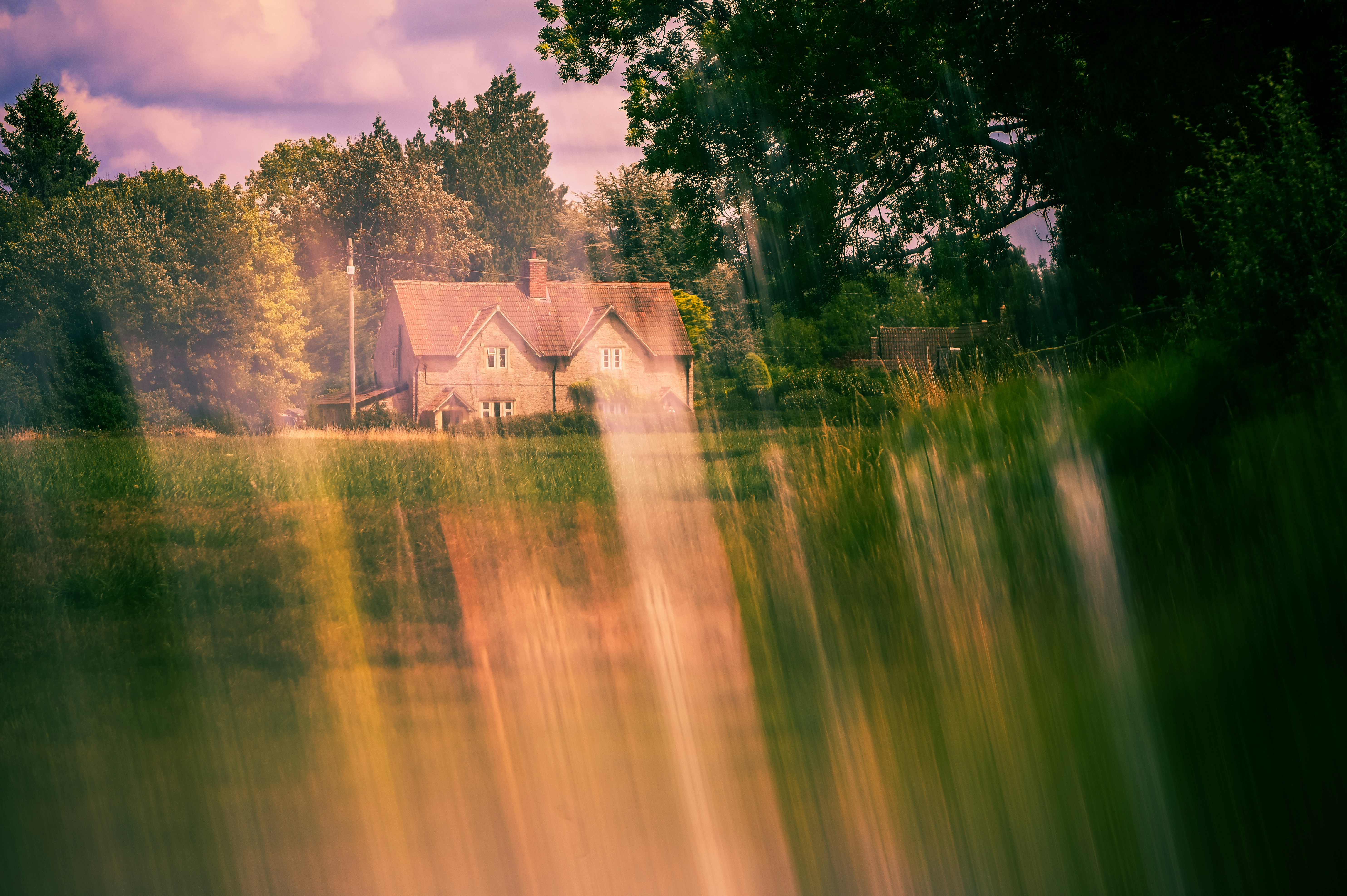 Using the ReflectLens // Supernova filter on Tamron 70-300 | House stands amidst a blurry, light-streaked landscape.