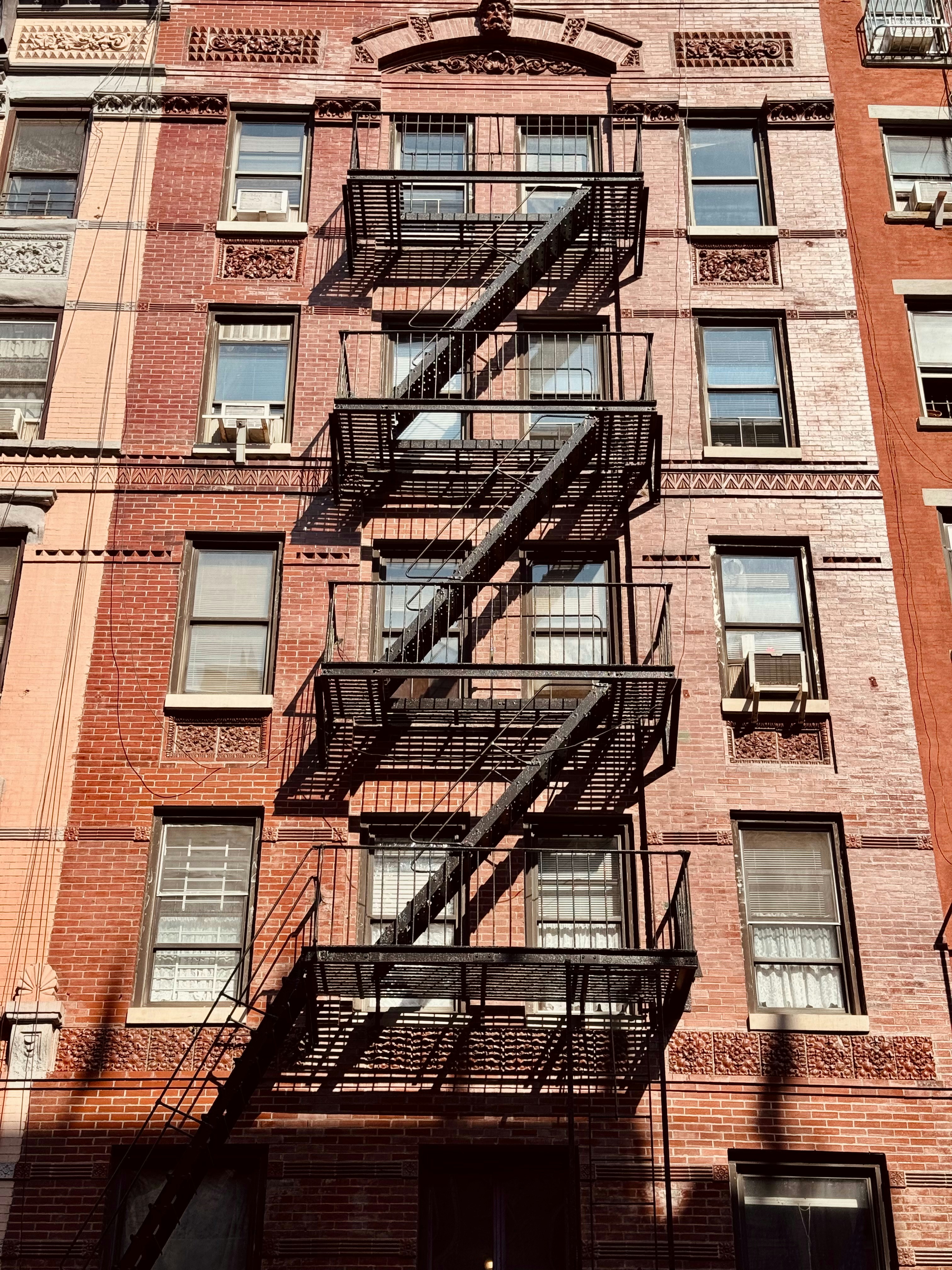 An old brick building with a fire escape.