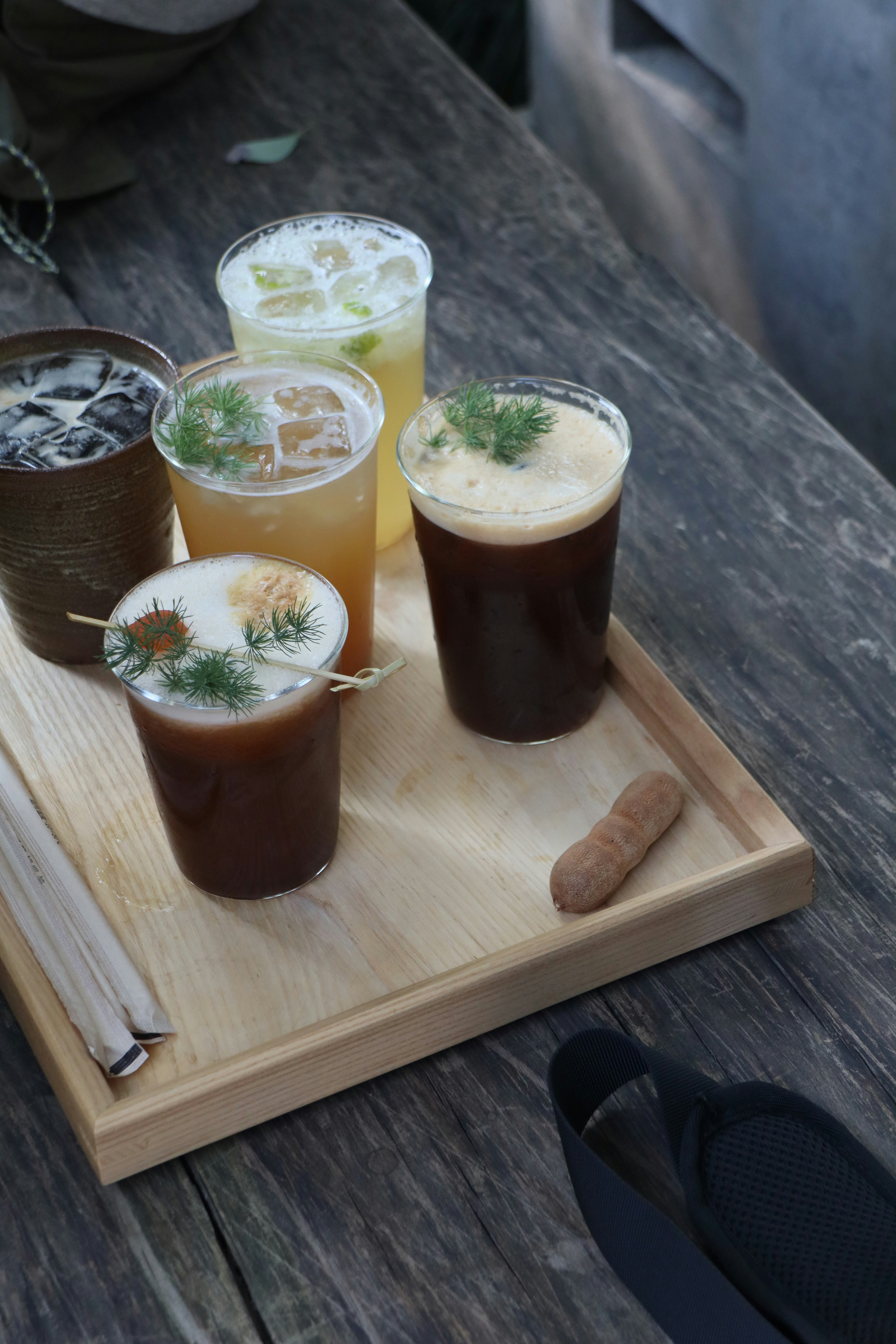 A Refreshing Quartet of Beverages on a Rustic Platter