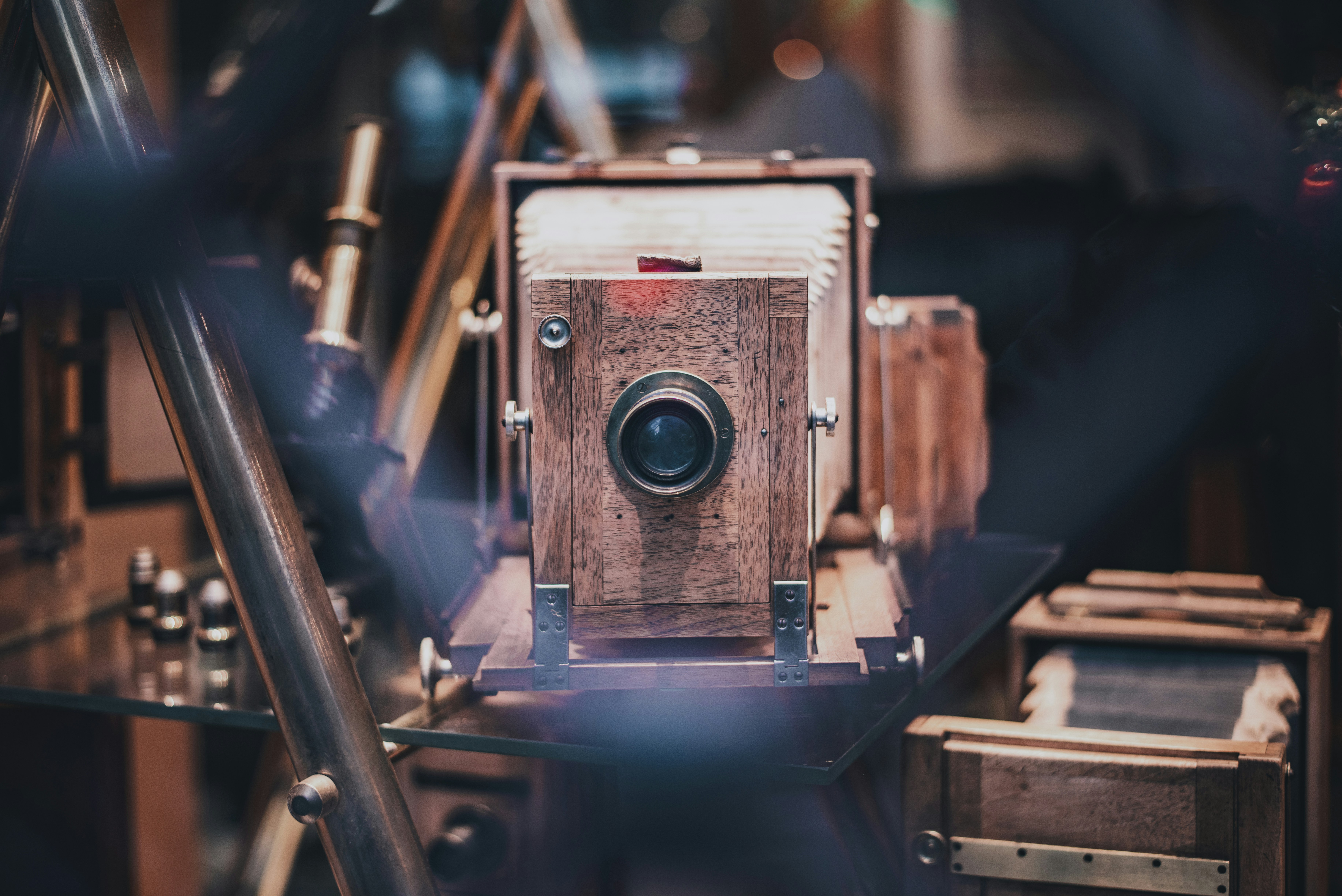 An old wooden camera sits on display.