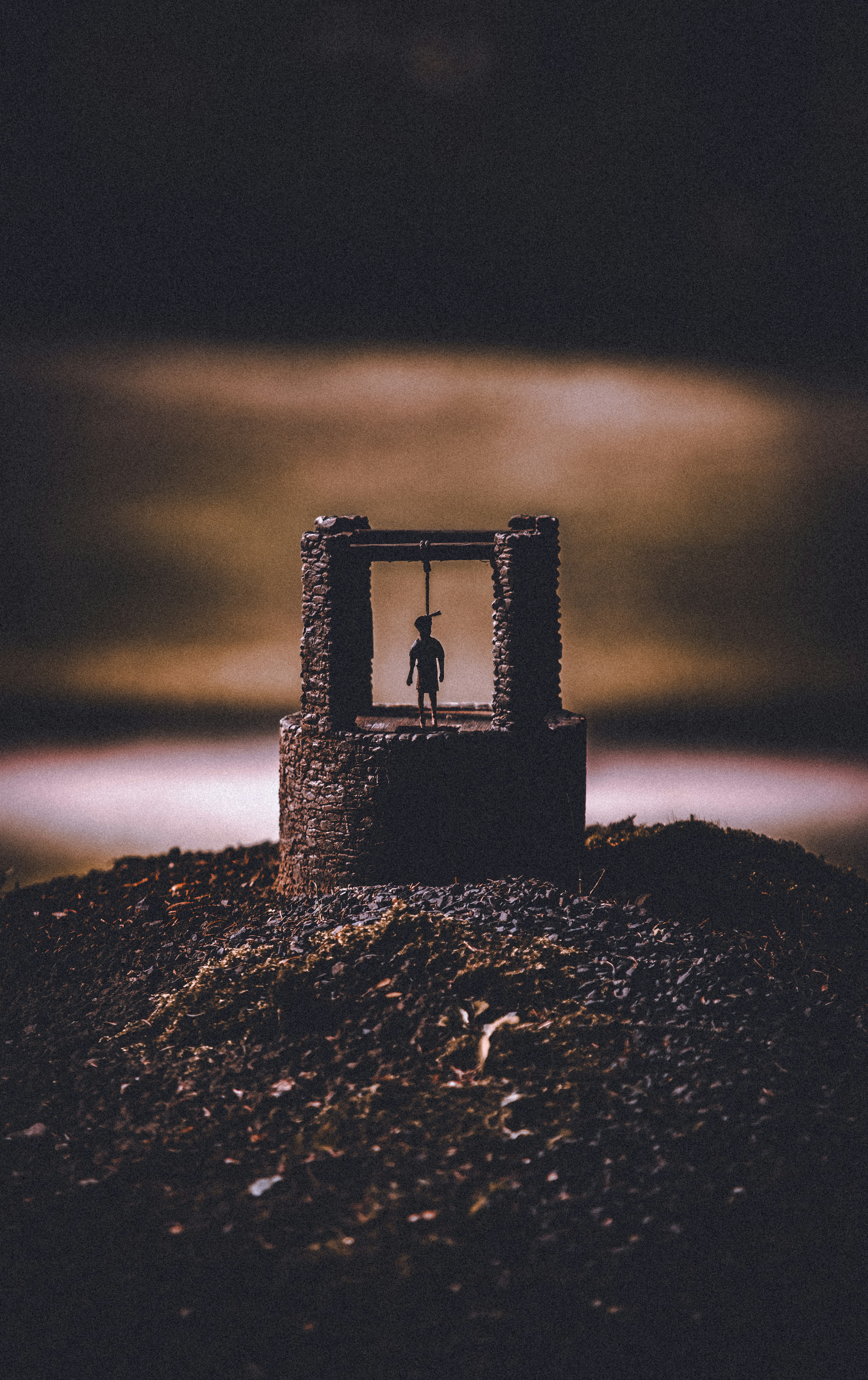 Silhouette on the Stone Frame: A Lone Figure at the Bridge of Echoes