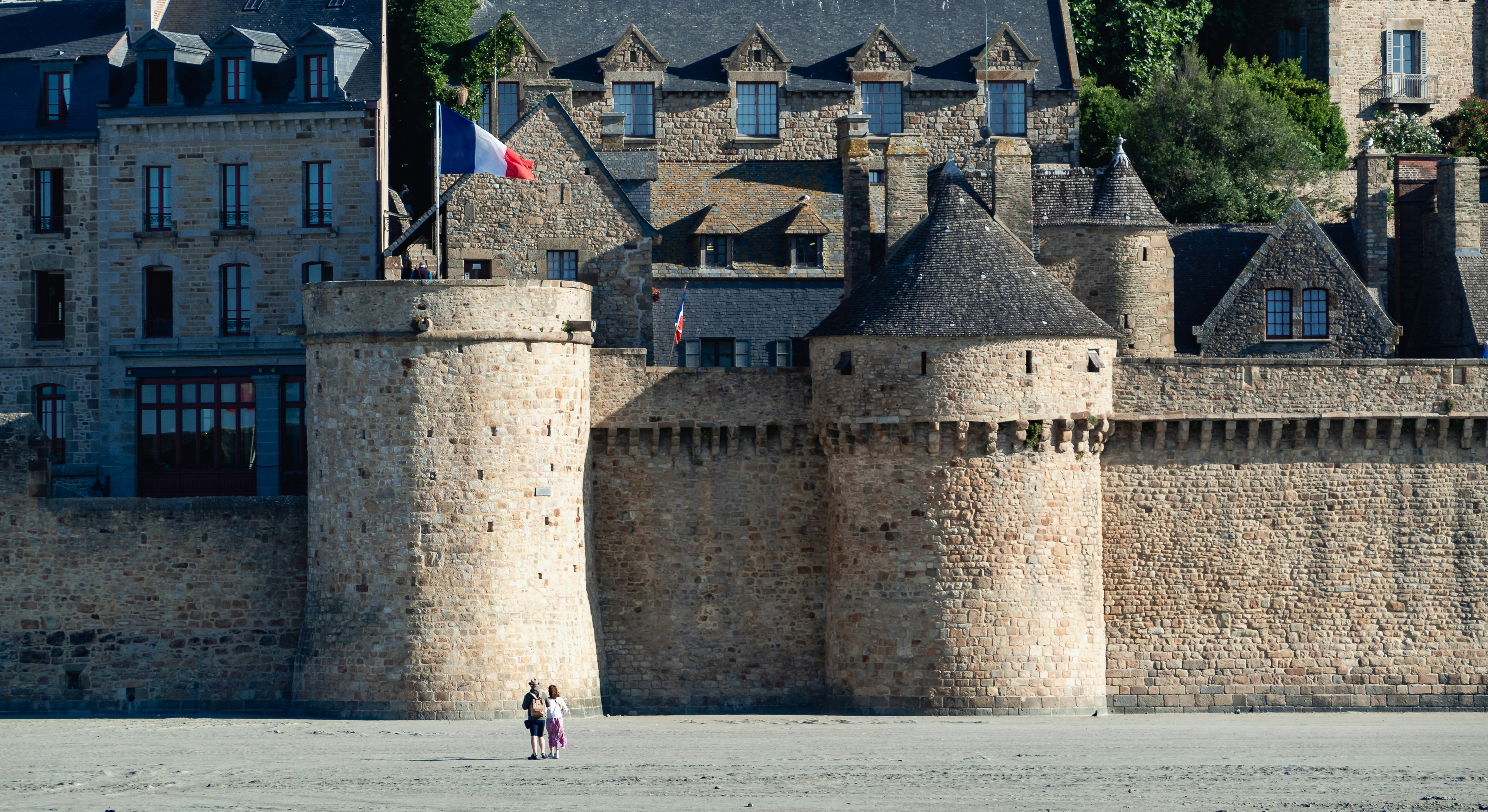 OLYMPUS DIGITAL CAMERA | Historic french buildings and walls are visible.