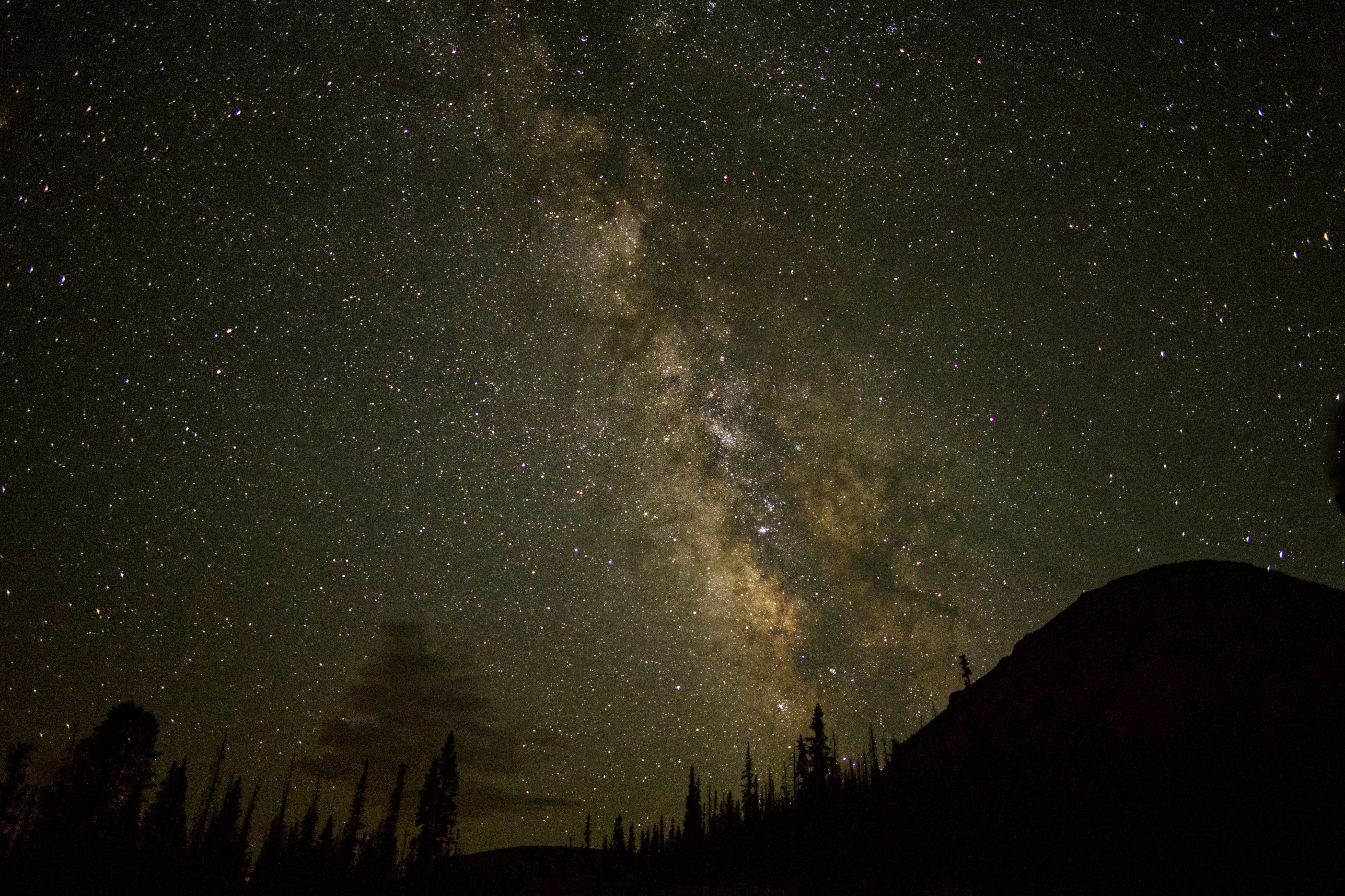 The milky way galaxy shines brightly in the night sky.