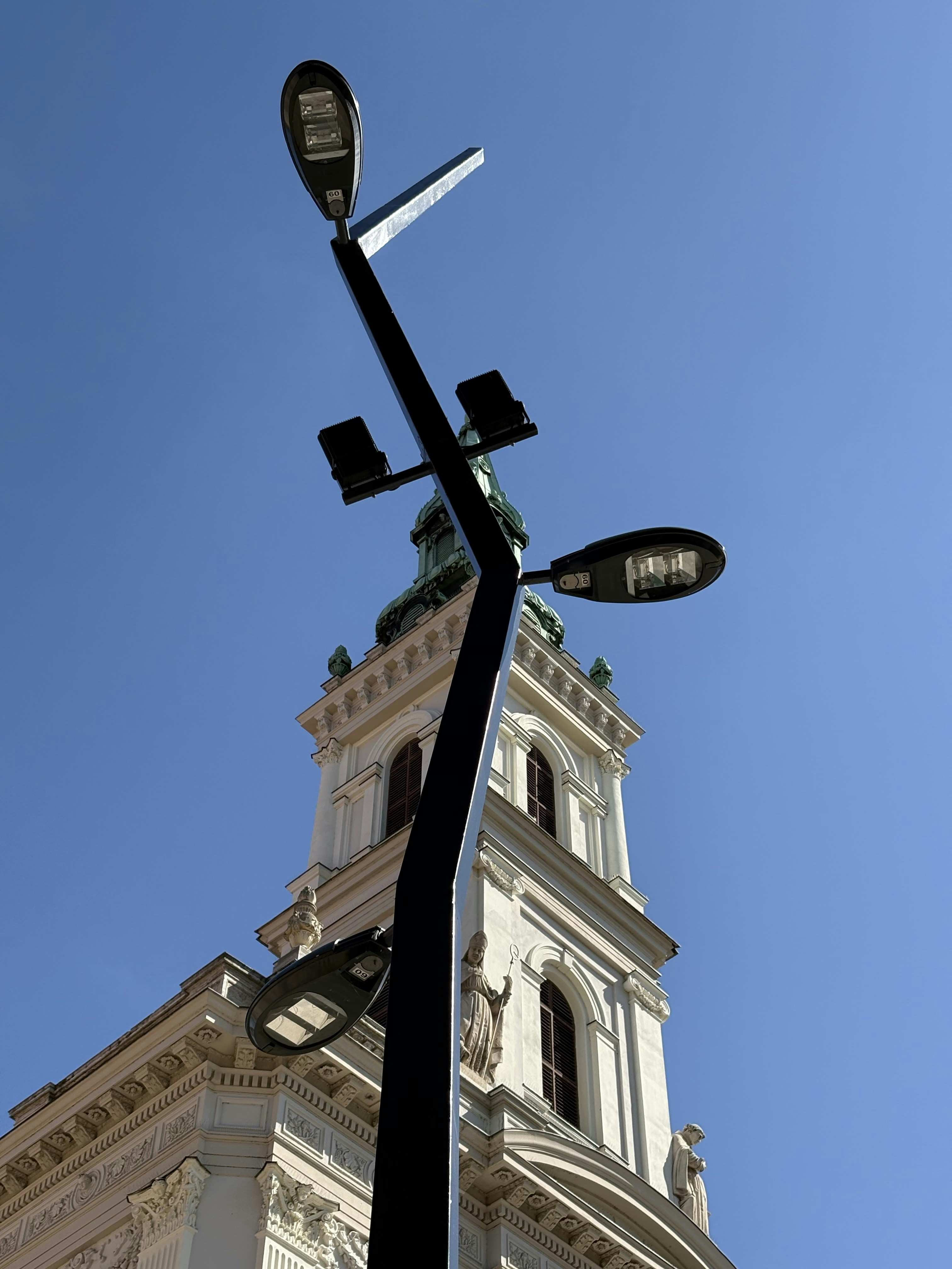 A street lamp and a church tower.