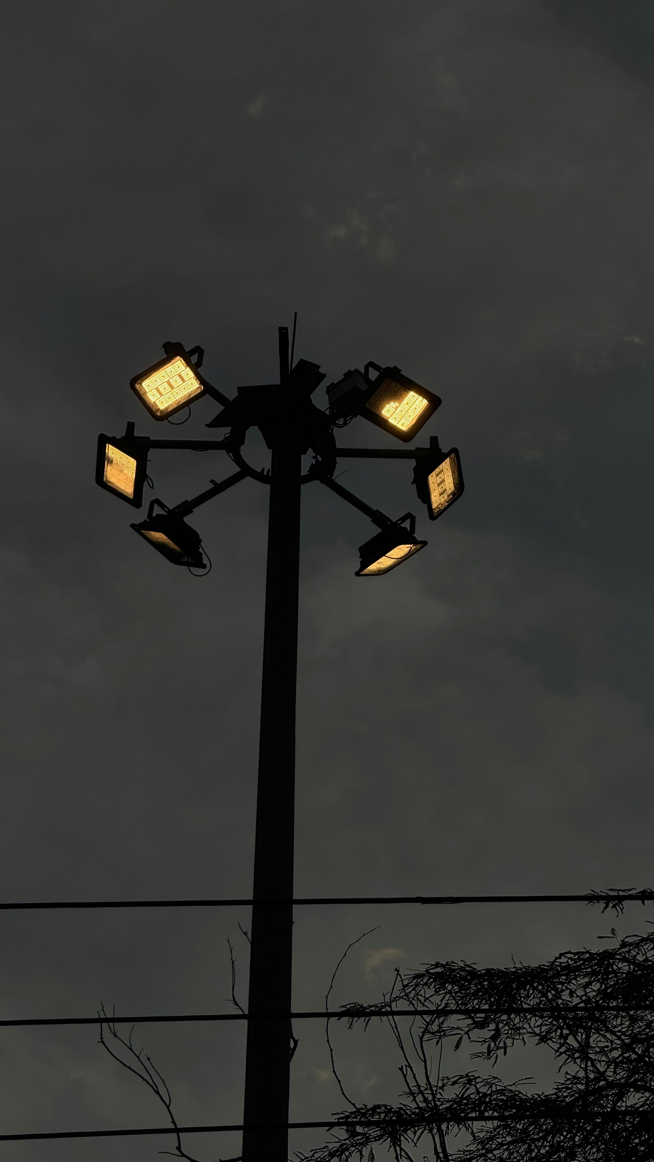 Street light | Streetlights illuminate the night sky.