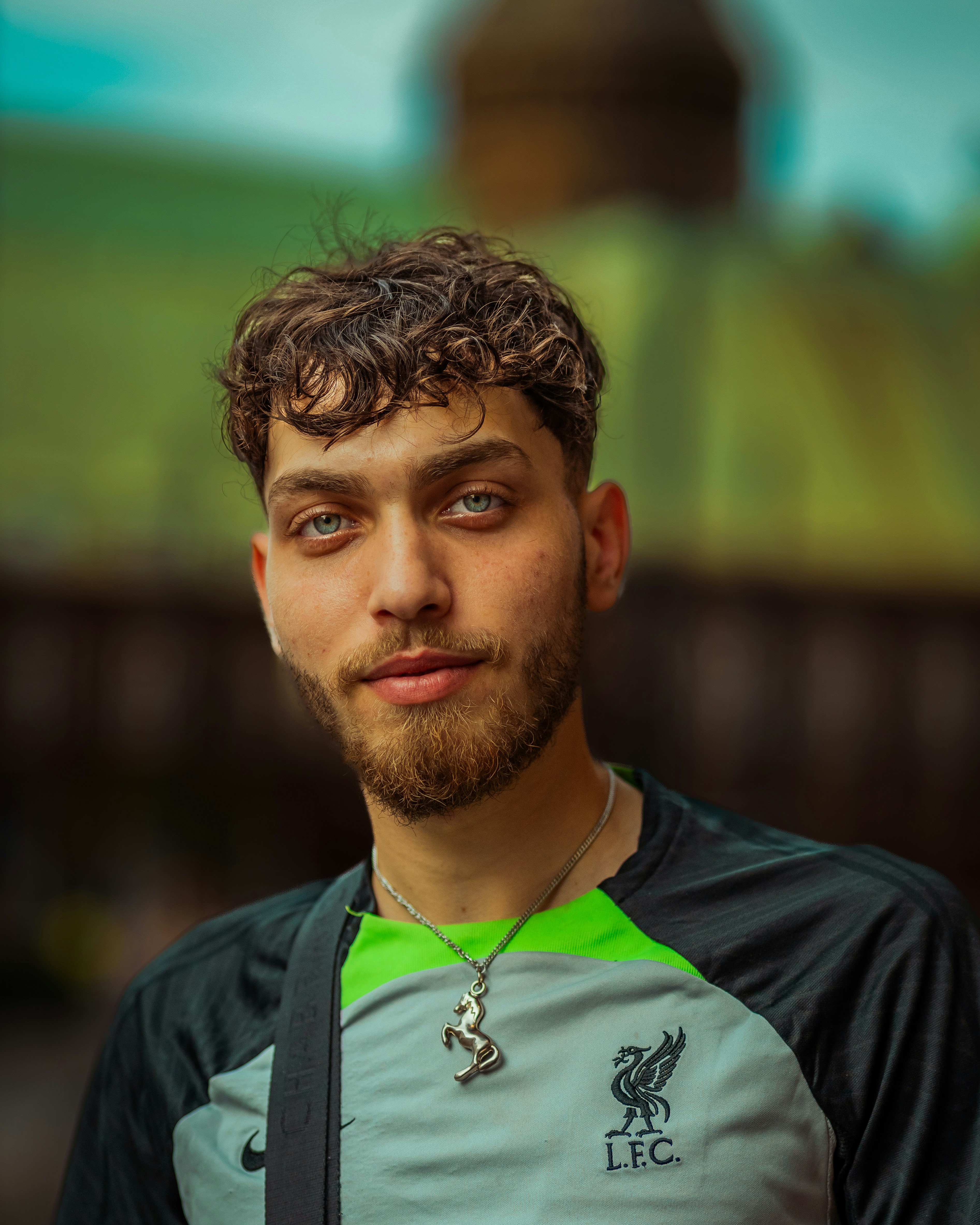 A young man poses for a portrait.