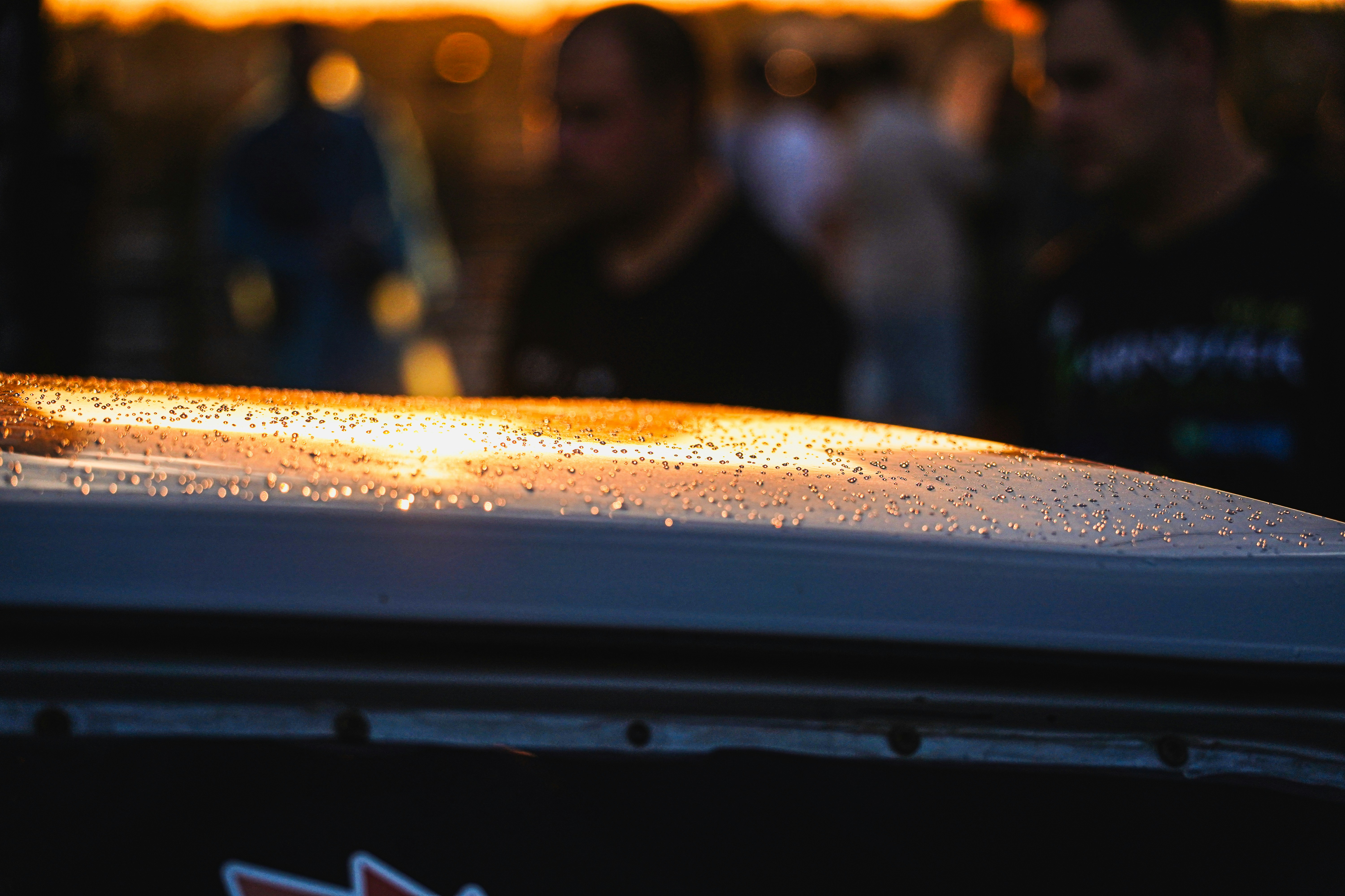 Dewlit Edge: Dawn Light on a Glossy Car Roof