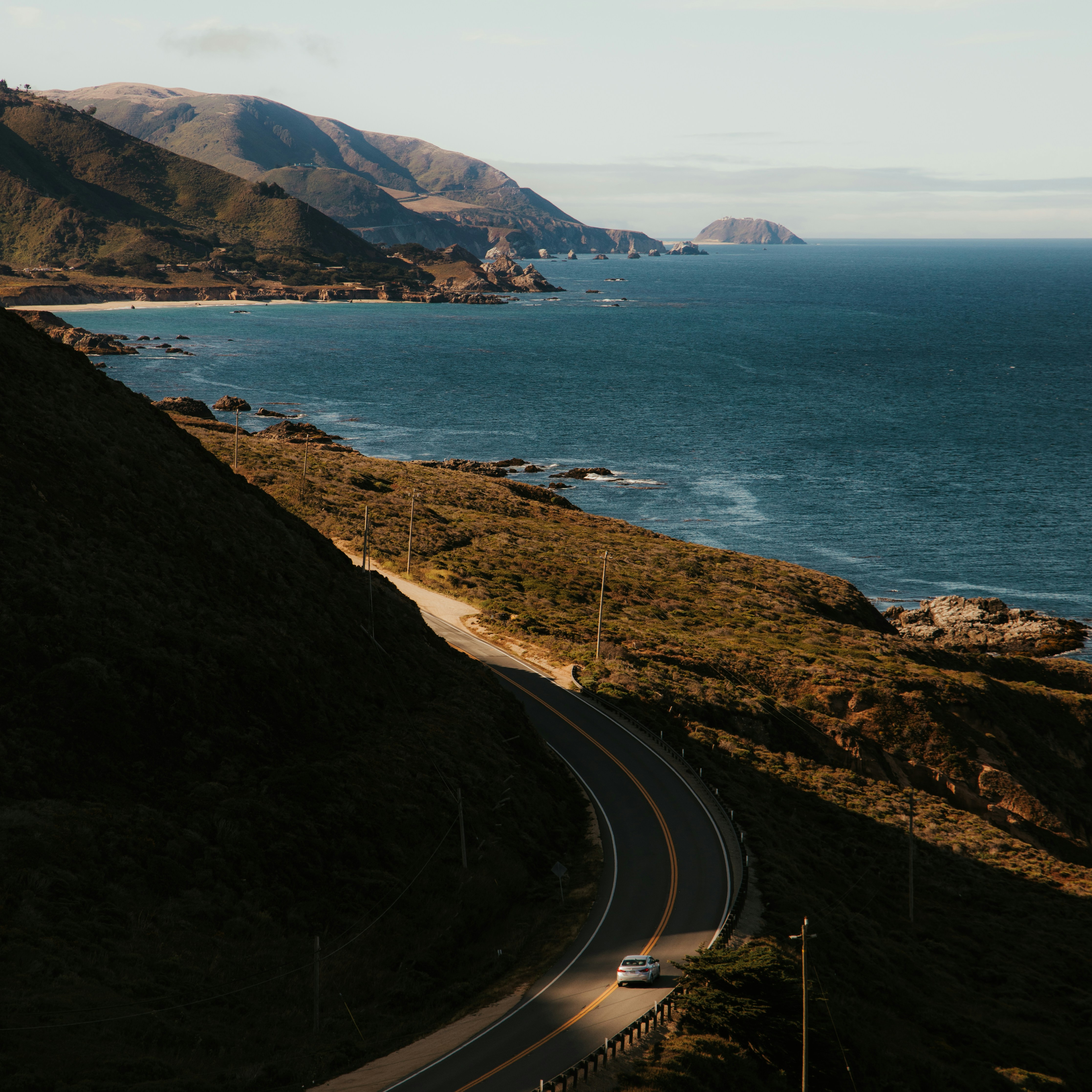 Coastal highway winds along the shore.