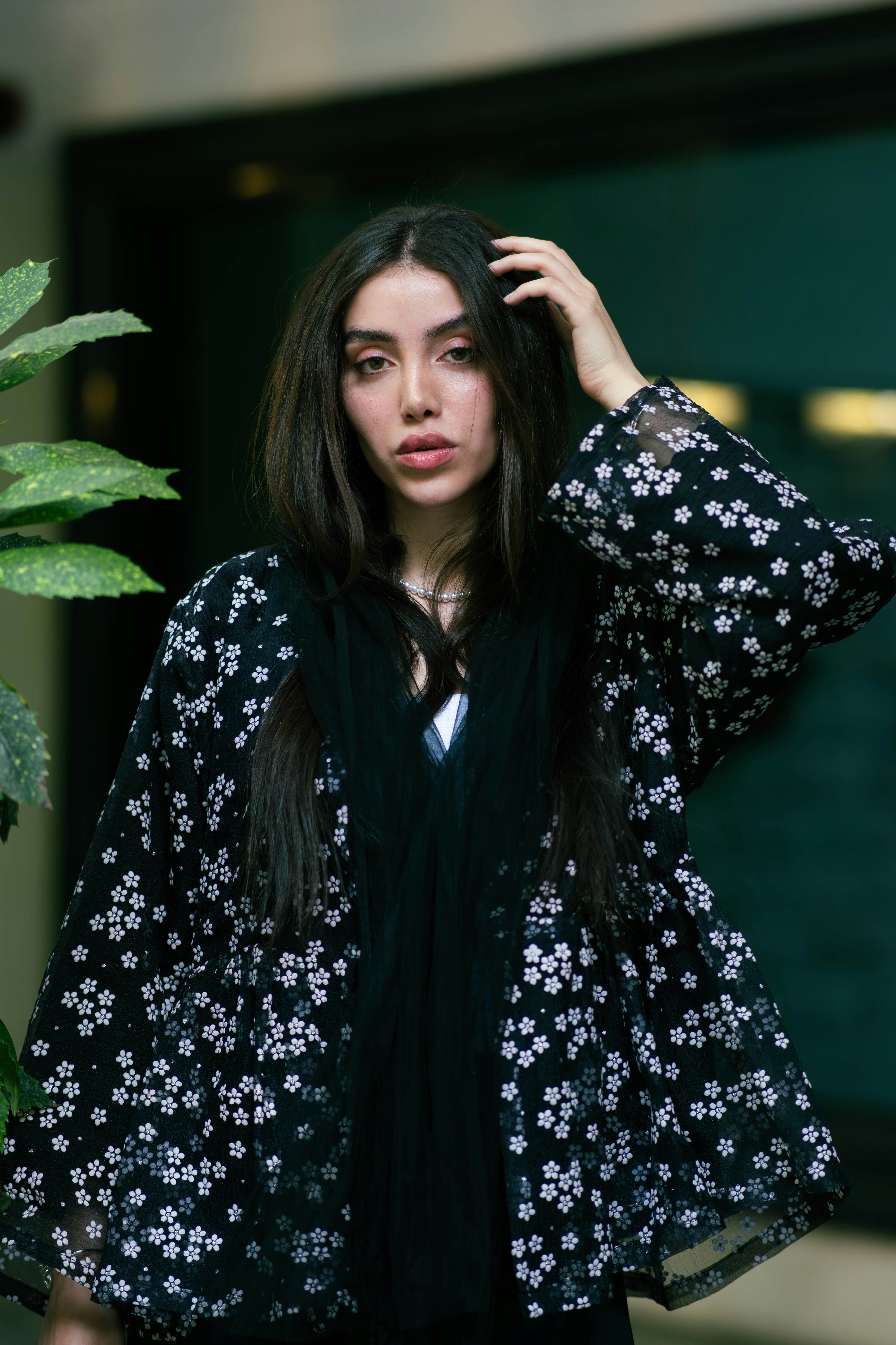 Photograph by Amin Naderloei | Beautiful woman poses in a black patterned jacket.