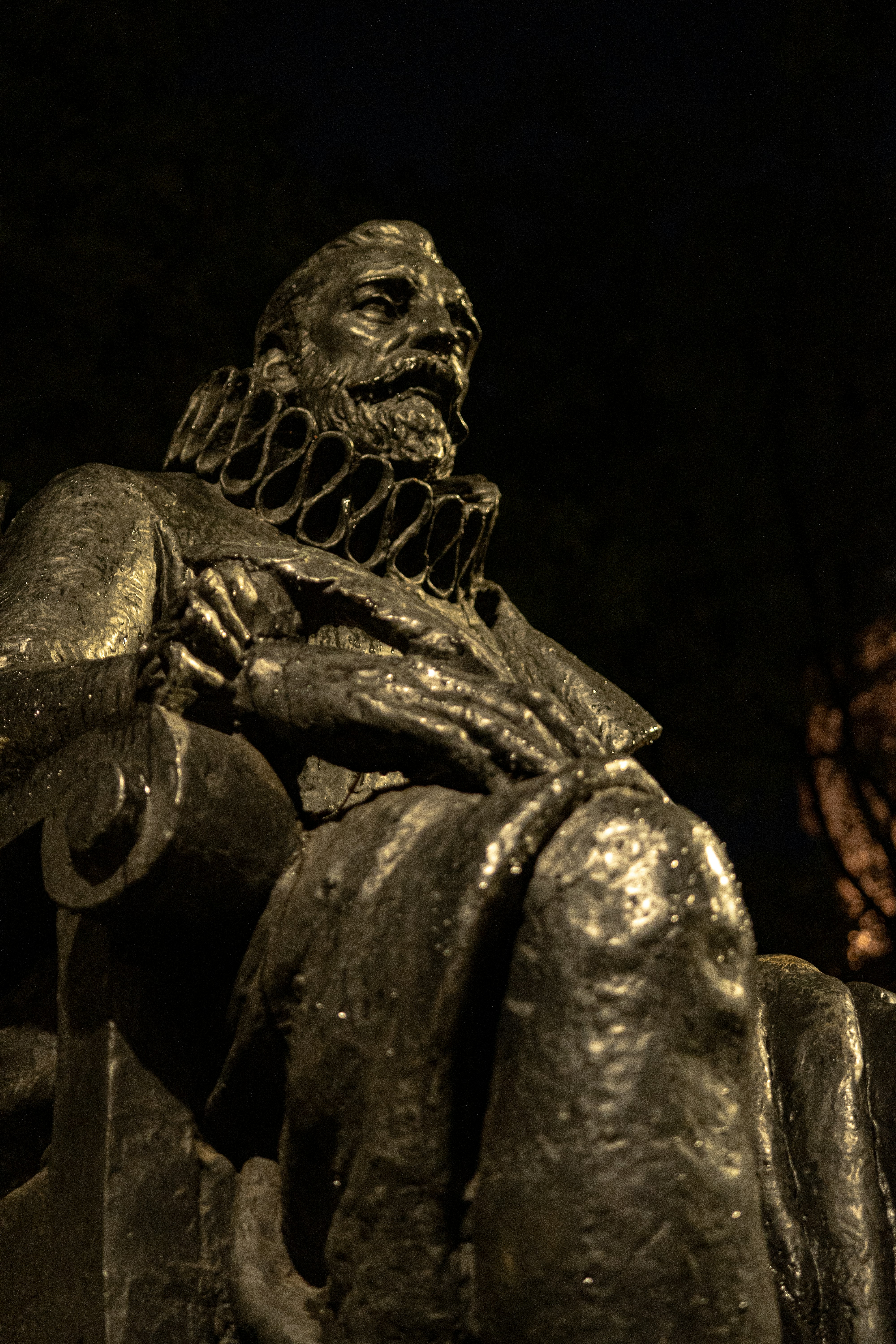 Statue of a man in a formal pose.