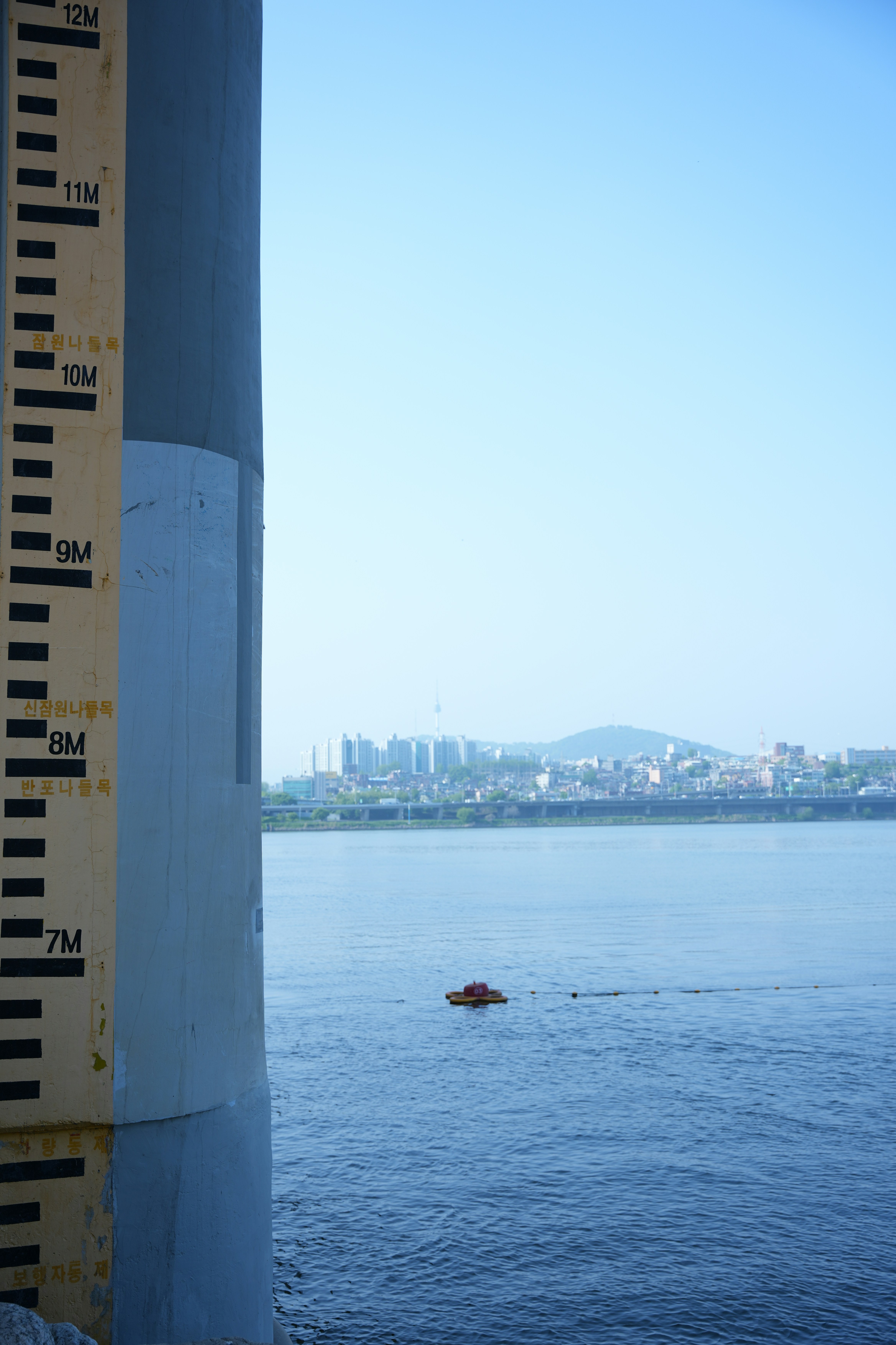 Water gauge marks water level against the clear blue sky.