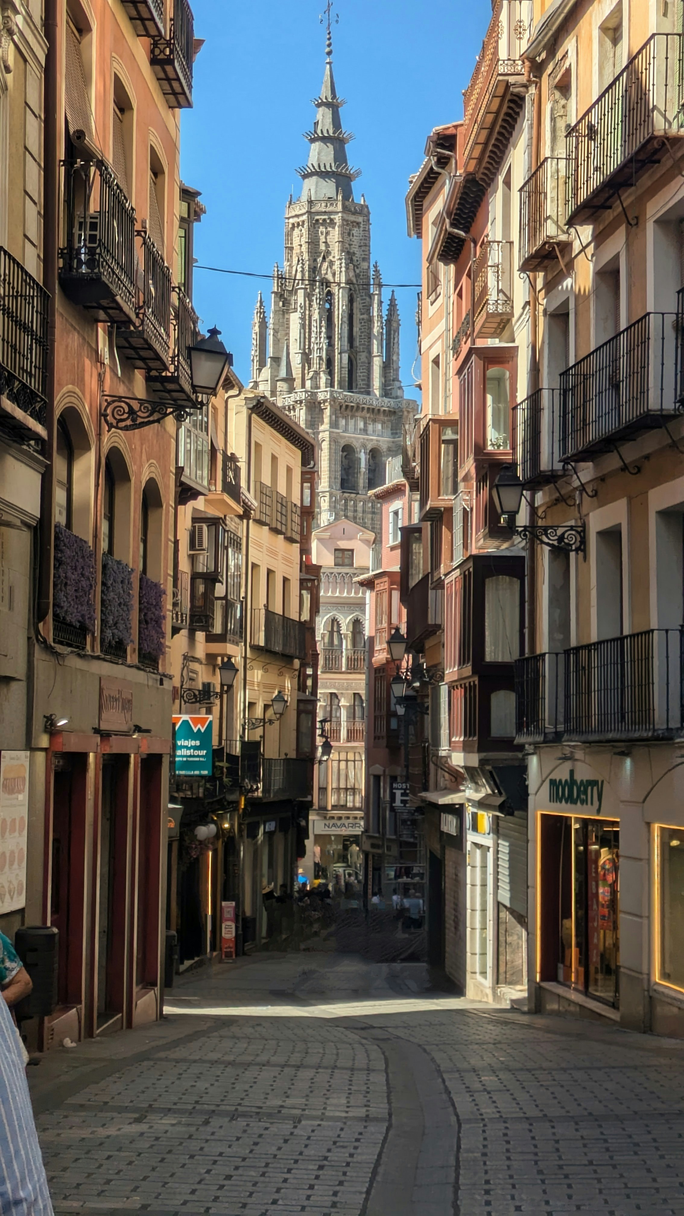 The former capital of Spain, has some cultural aspects from three different religions! The city was for a long time home for many people with a different god, which was pretty impressive for this time! | A narrow street leads to a cathedral.